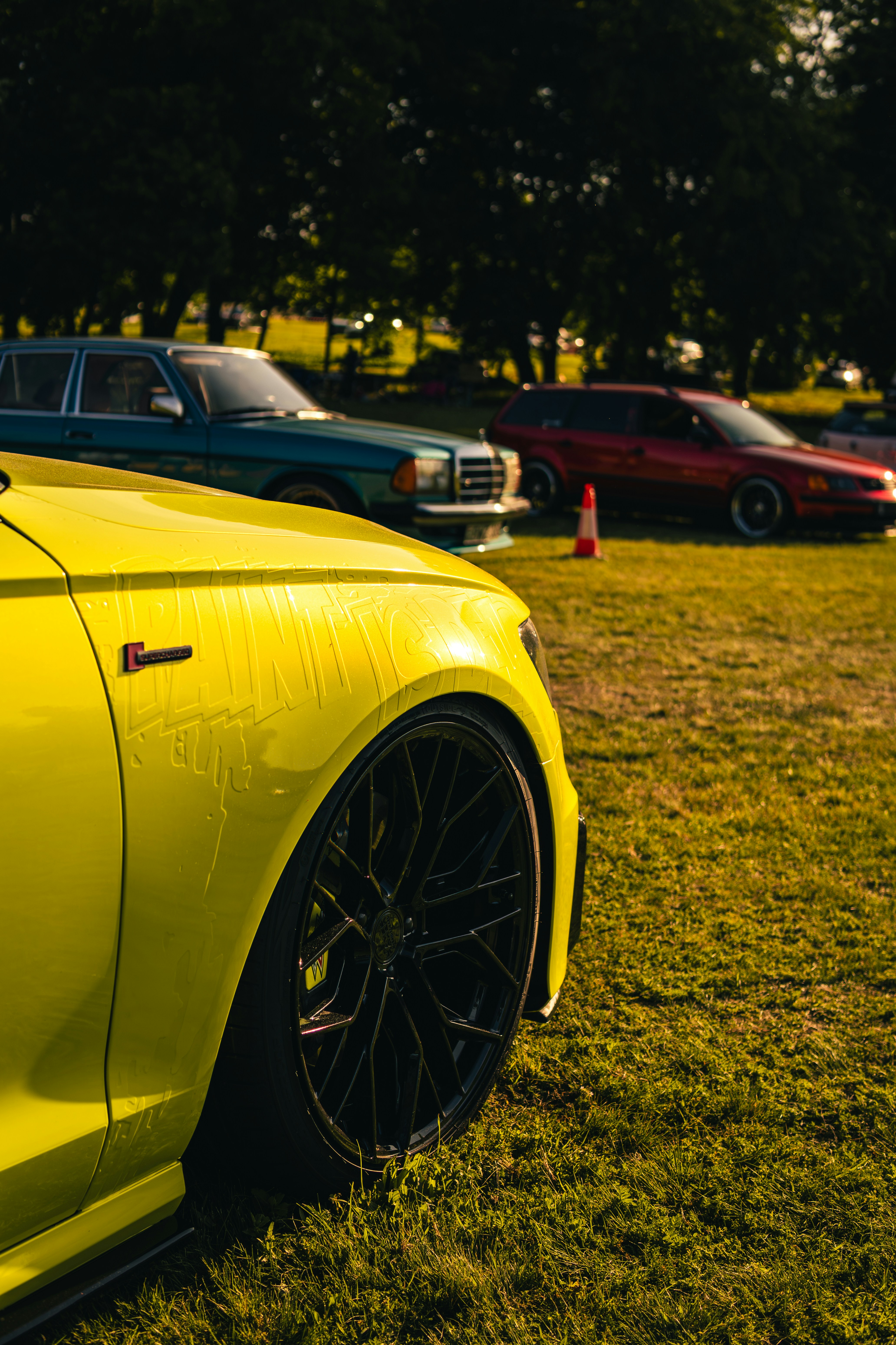 Neon Yellow Focus: A Sharp Look at a Parkside Sports Sedan under Sunny Show Lights