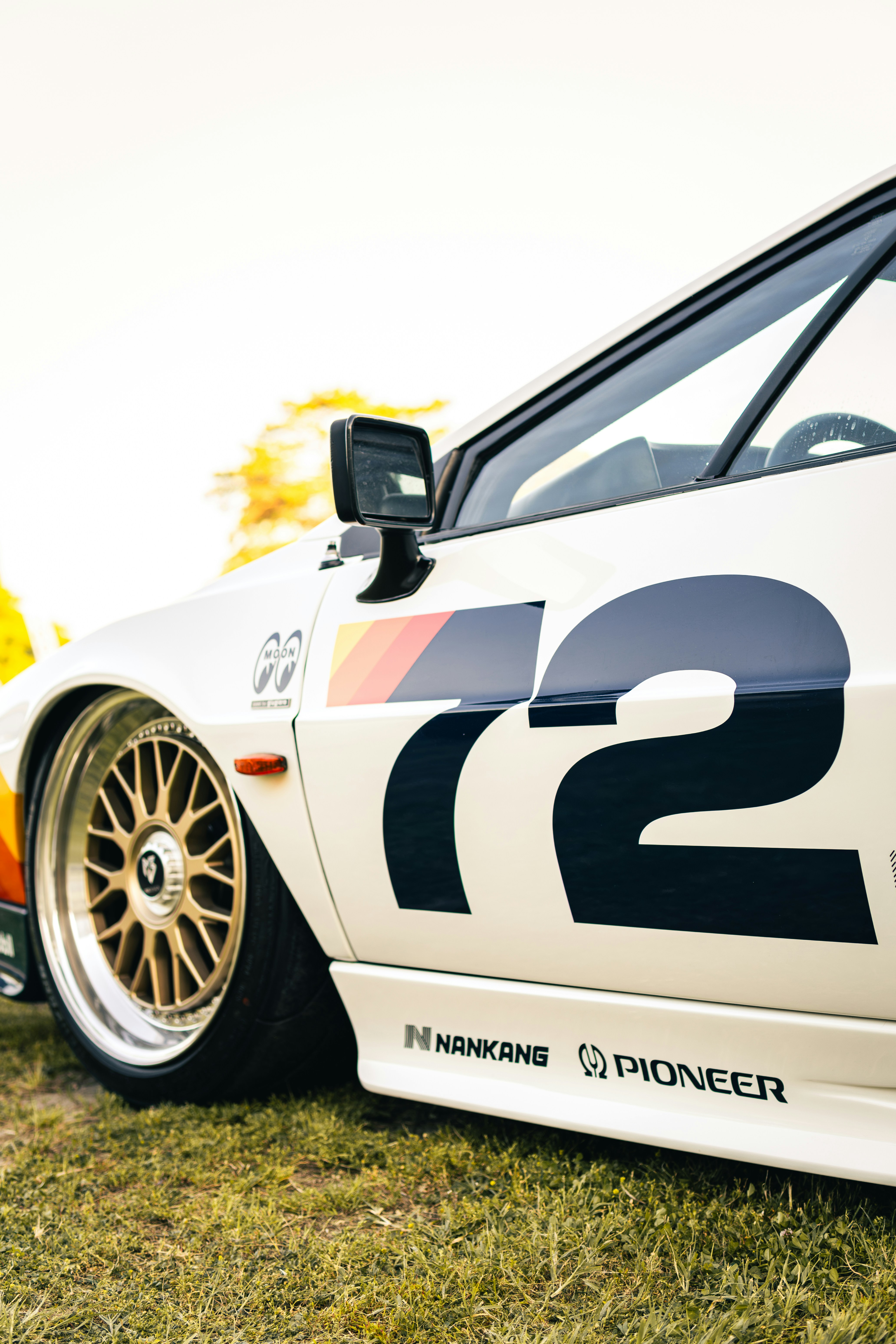 Gold Wheels and Bold Decals: A Close-Up on White Racing Livery