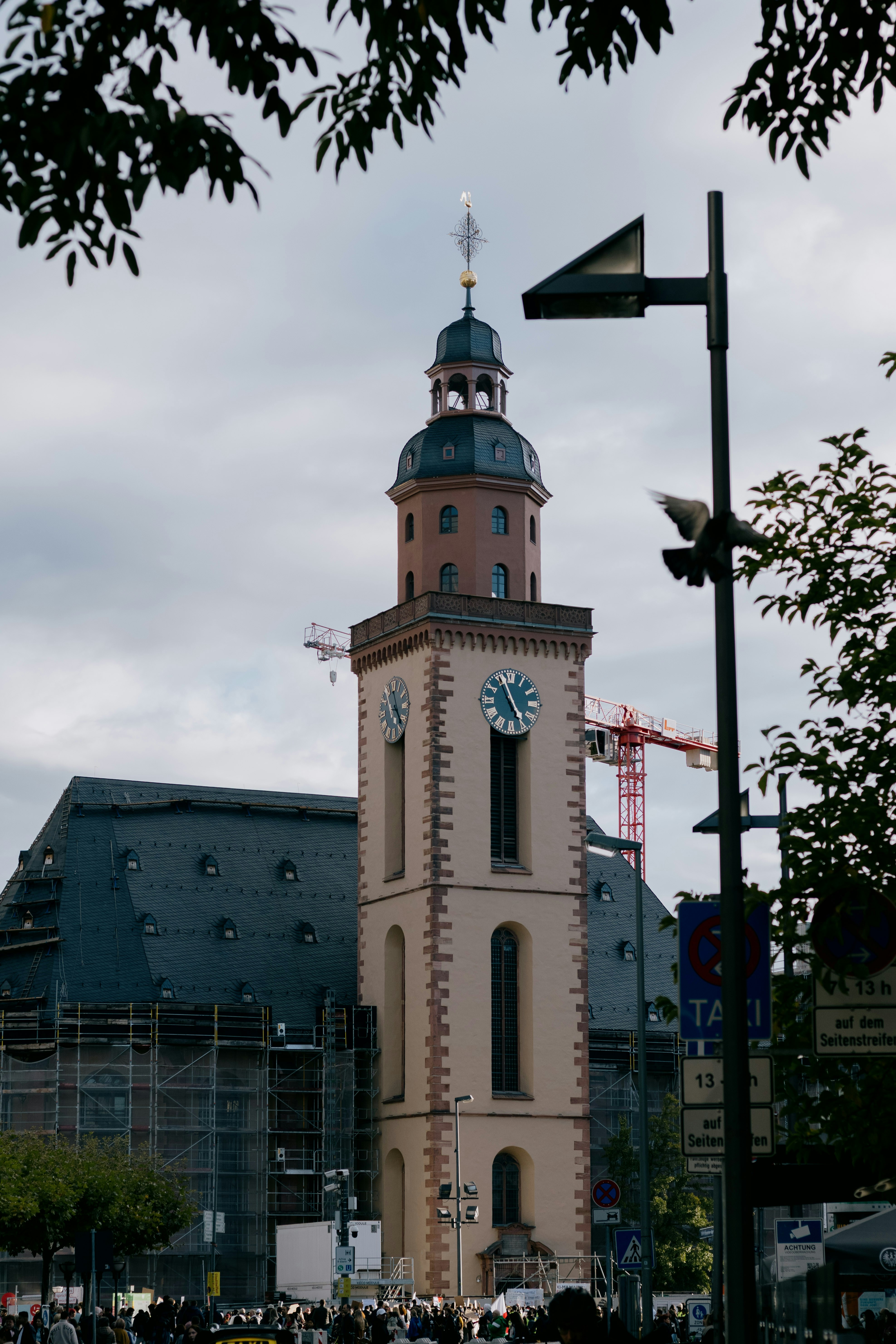 A clock tower with scaffolding on a building.