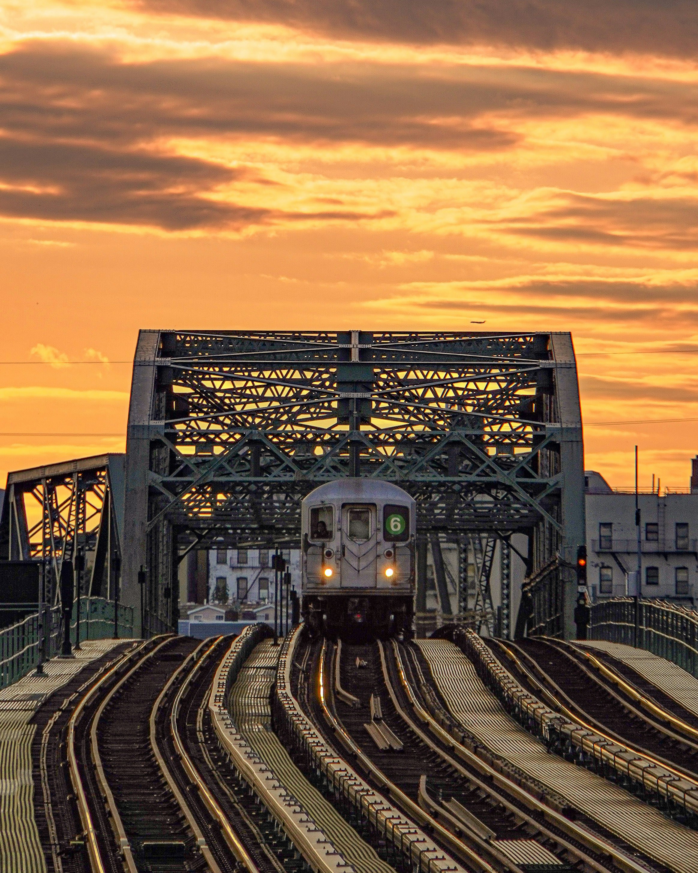 Crimson Crossing: Sunset Train on the Steel Arches