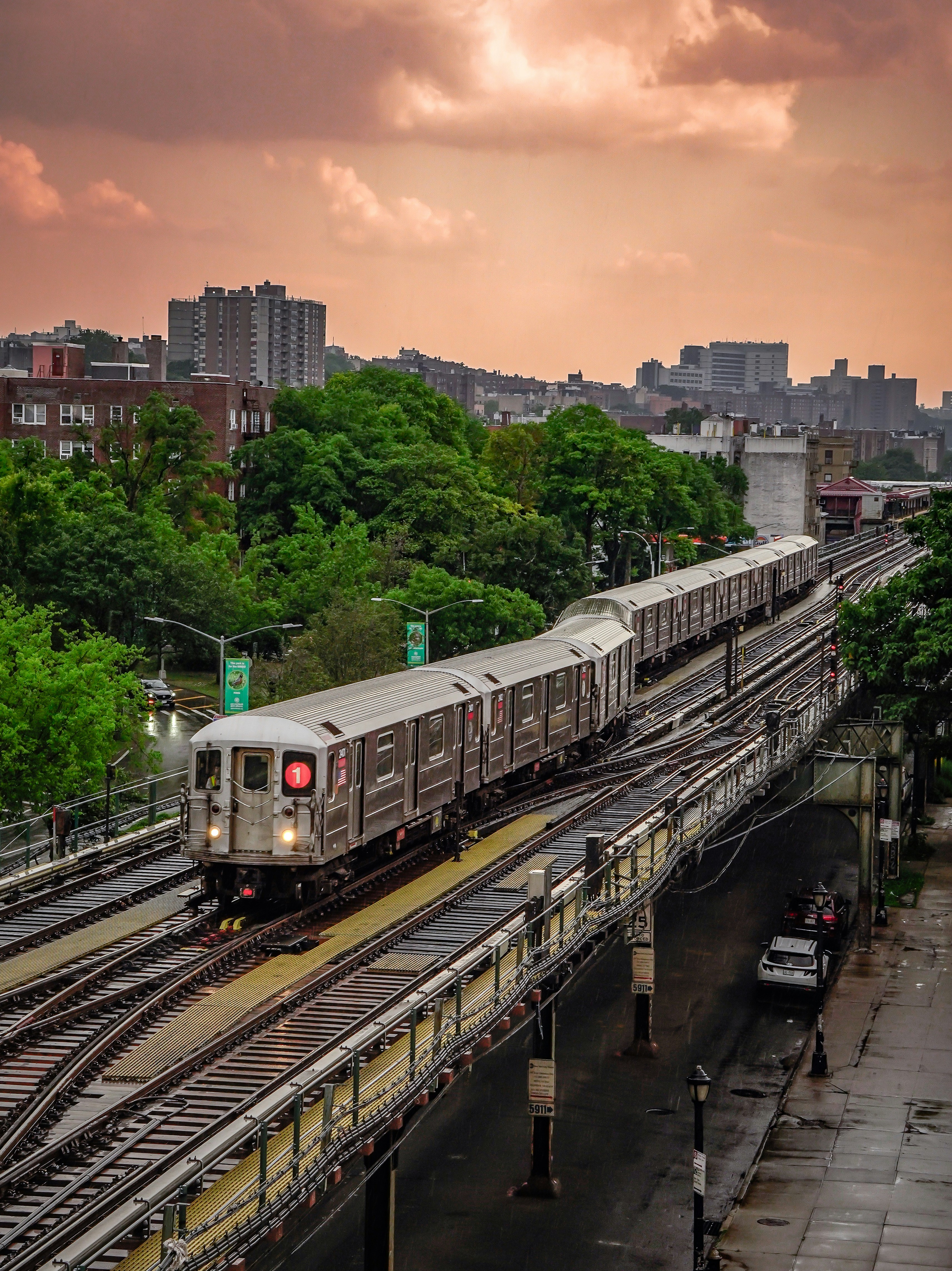 Cloudy With A Chance Of Meatballs - SMNYCMan | A subway train travels on an elevated track at sunset.