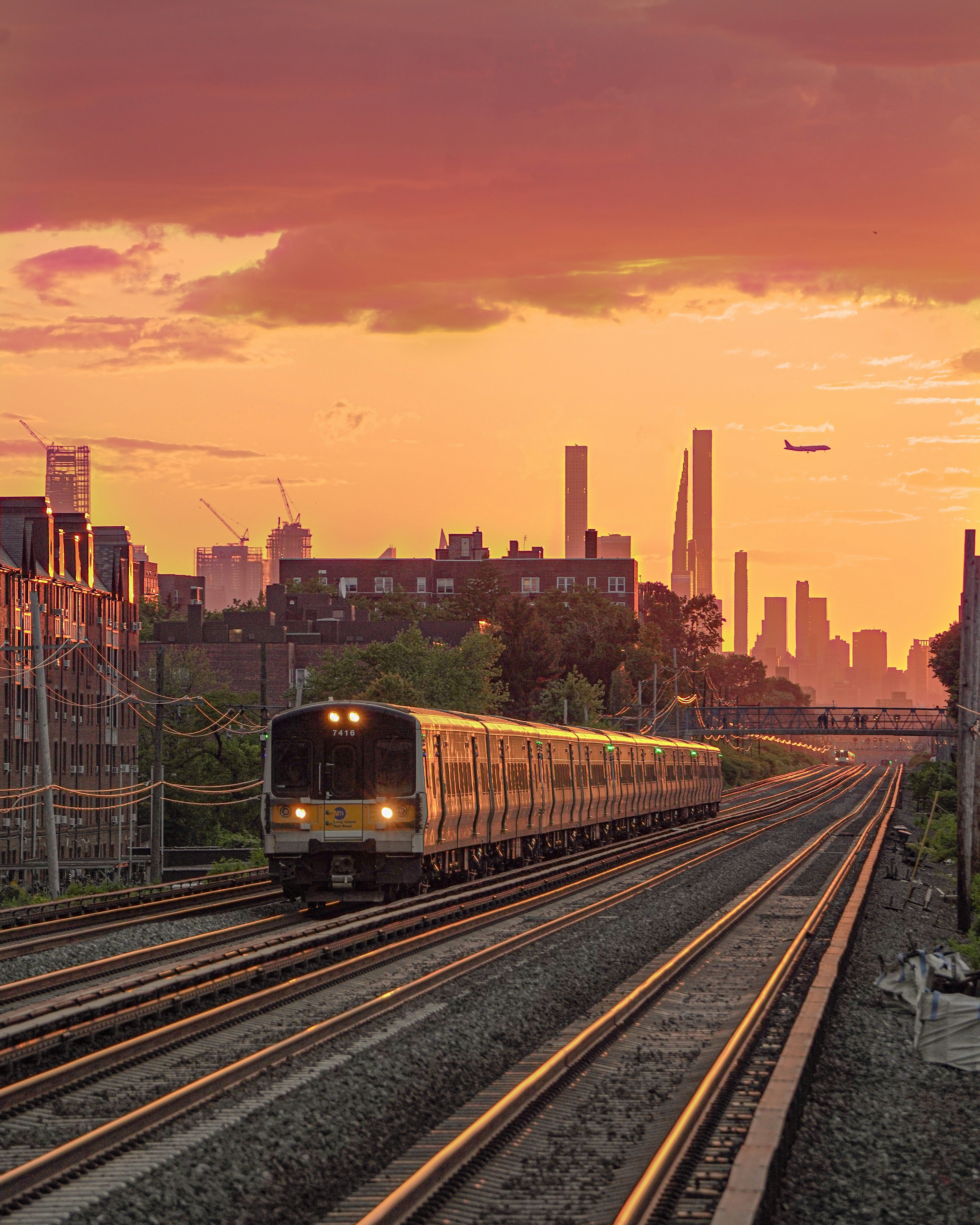 Urban Journey at Dusk: A Train's Passage