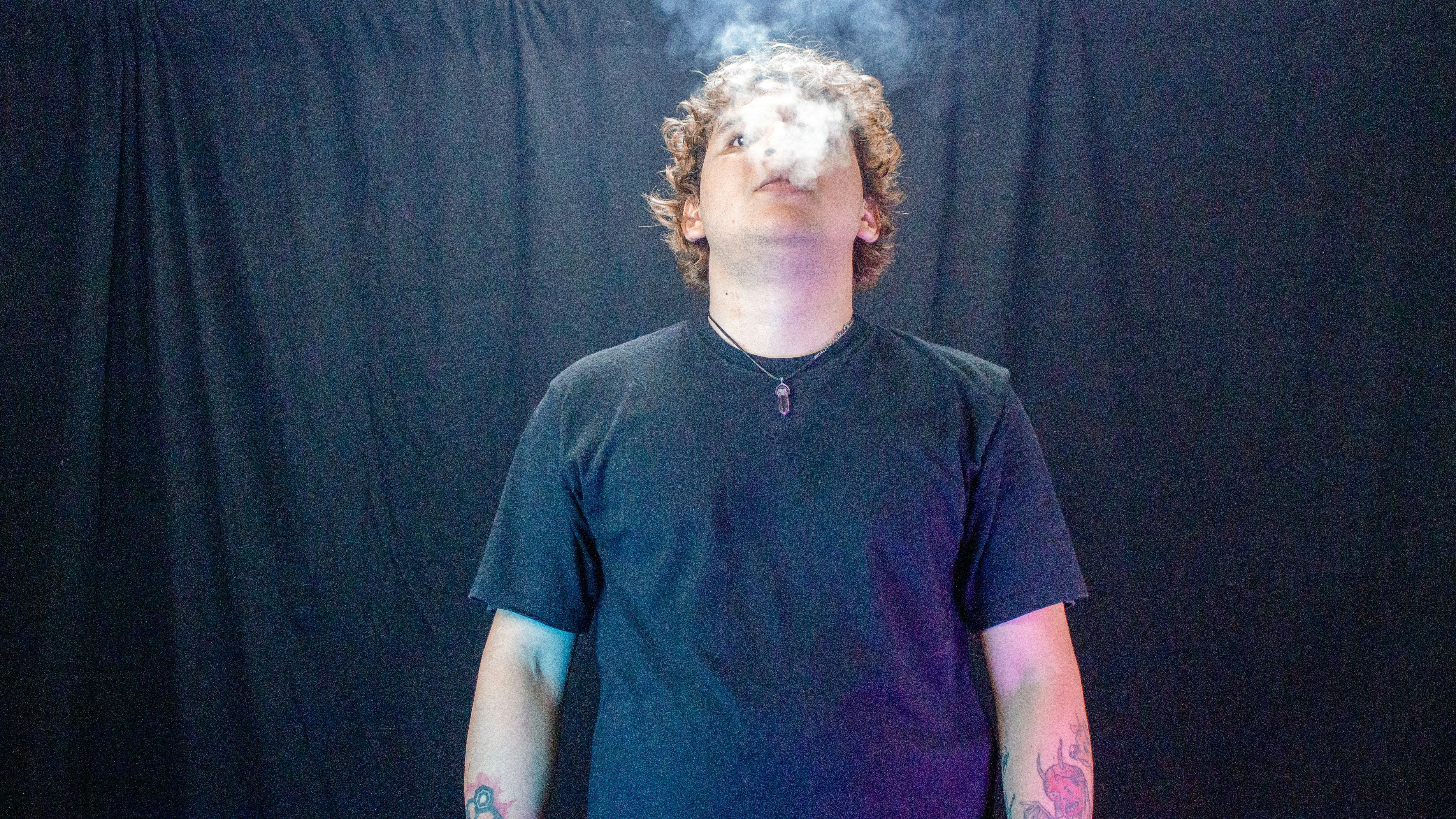 Smoke-Kissed Portrait Beneath a Velvet Backdrop