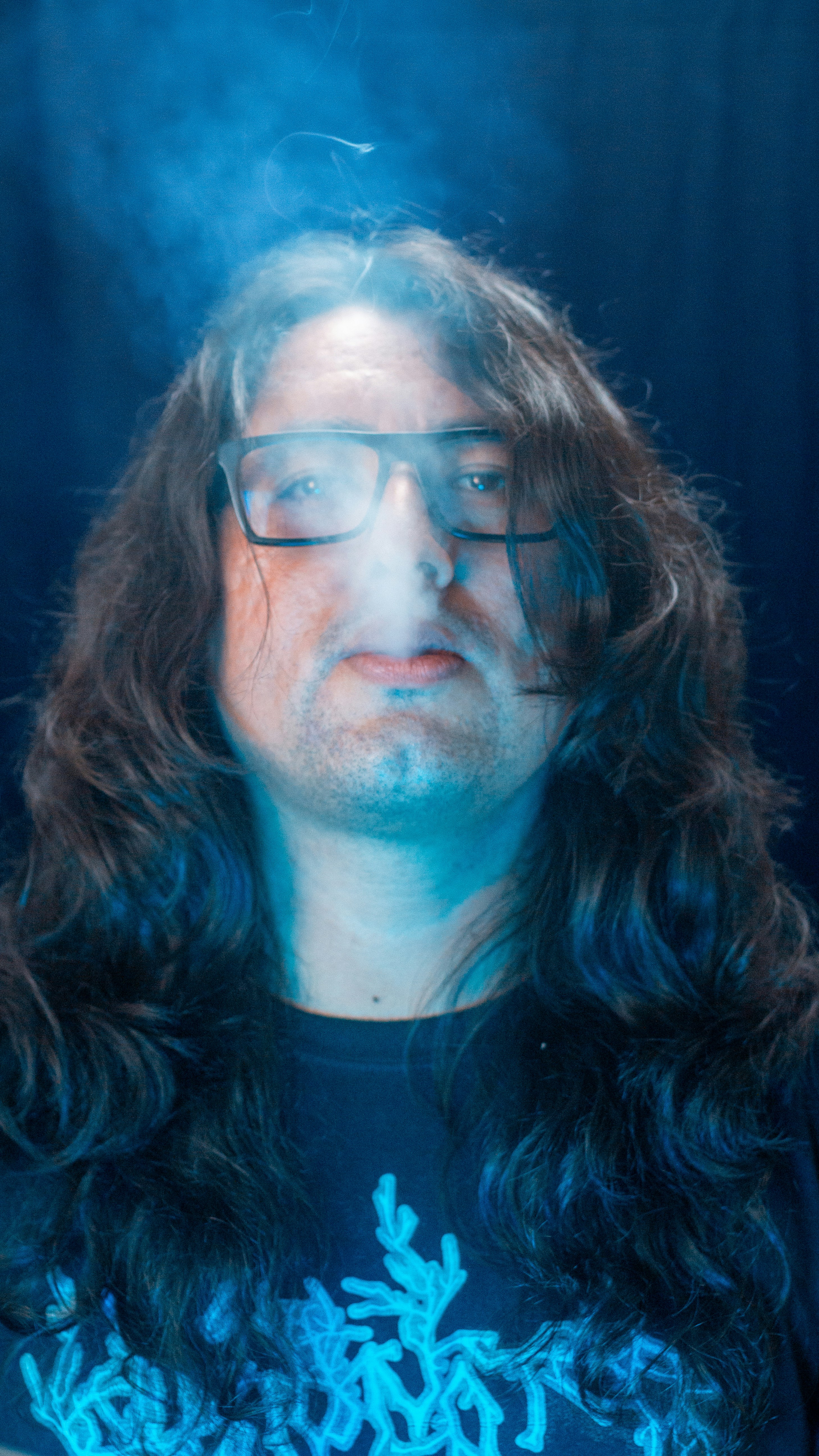 Veil of Smoke: A Portrait in Blue