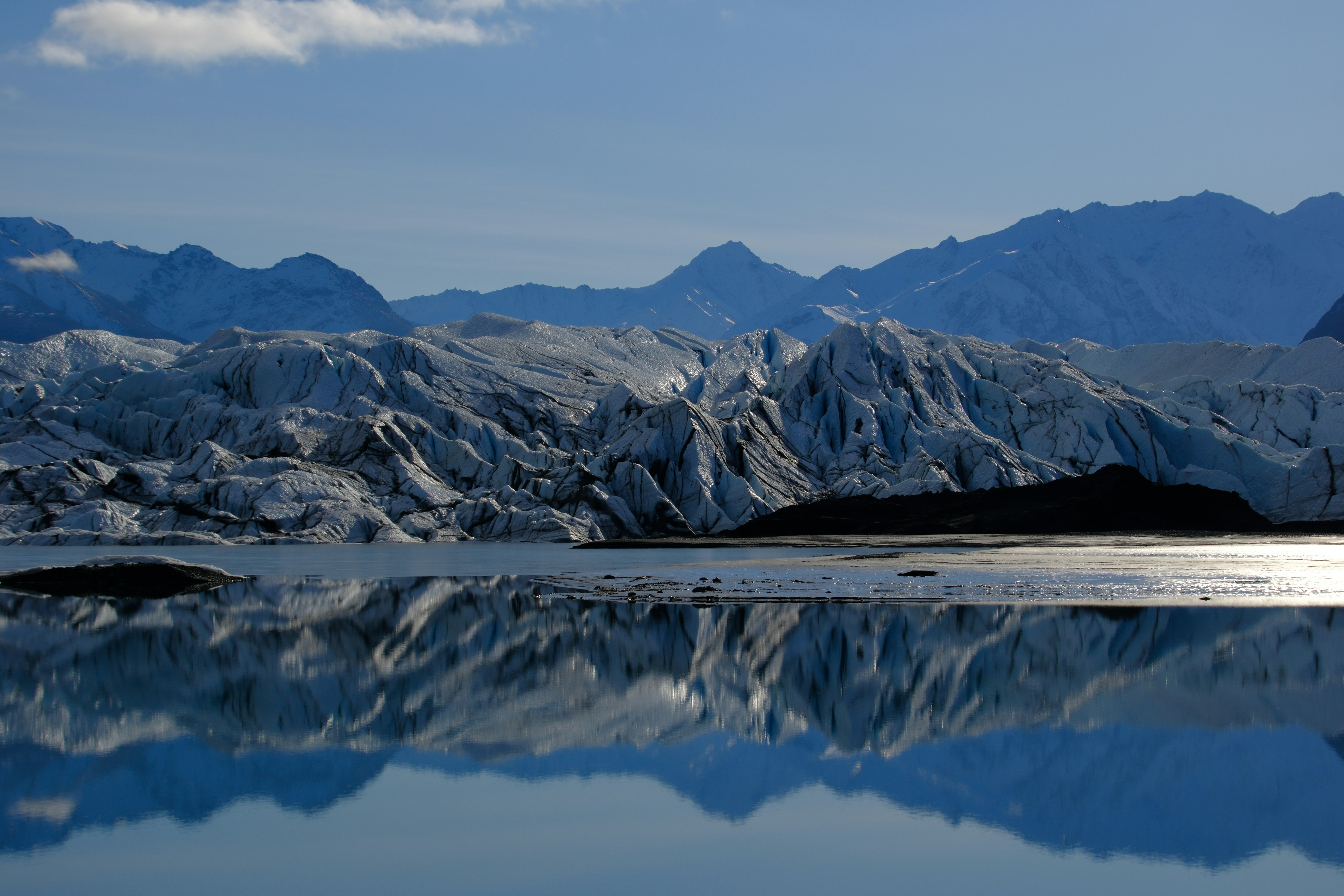 Matanuska Glacier | Glacier reflecting in still water with mountains beyond