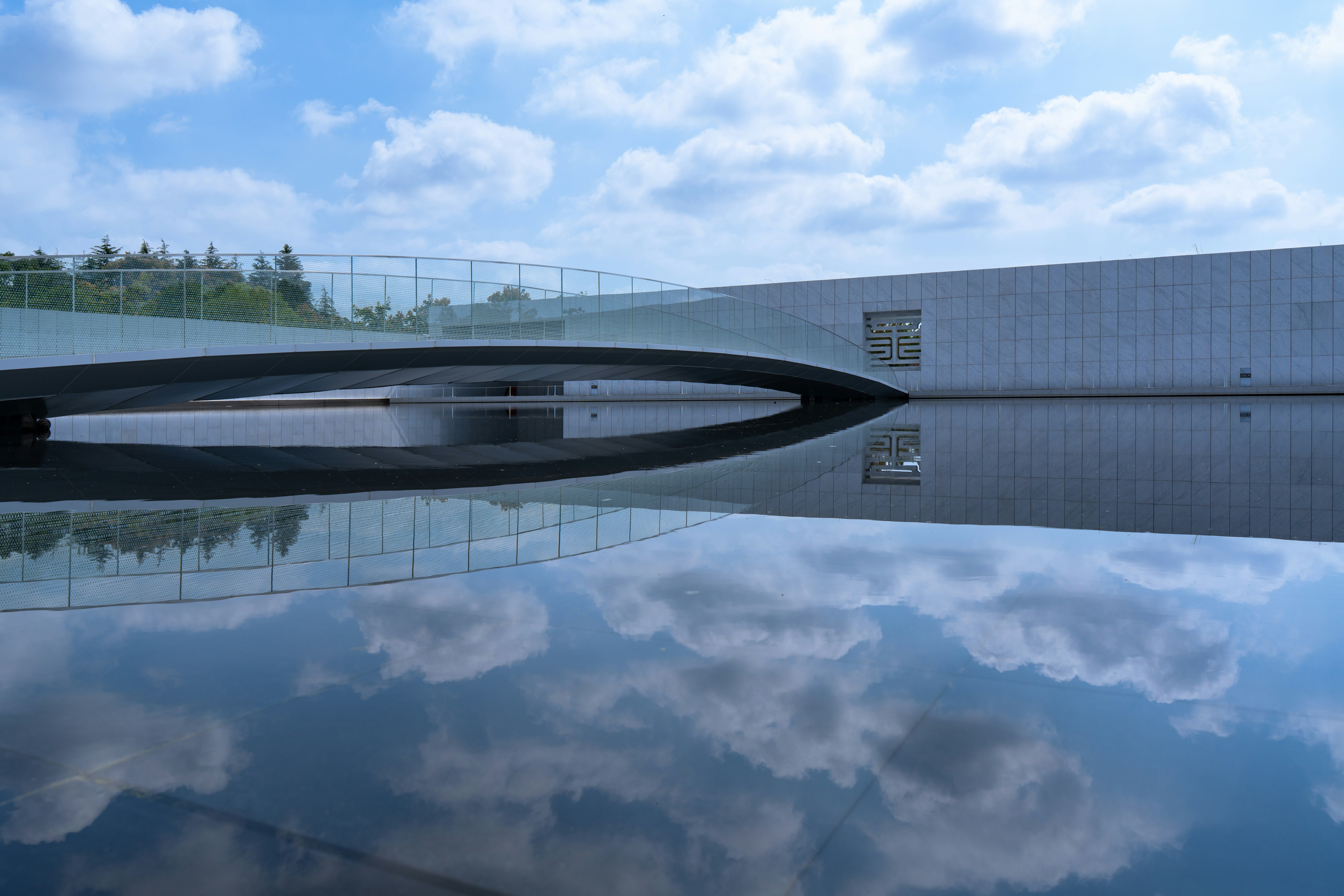 Crescent Arch and Sky-Glass: A Quiet Dialogue Across a Glassy Lake