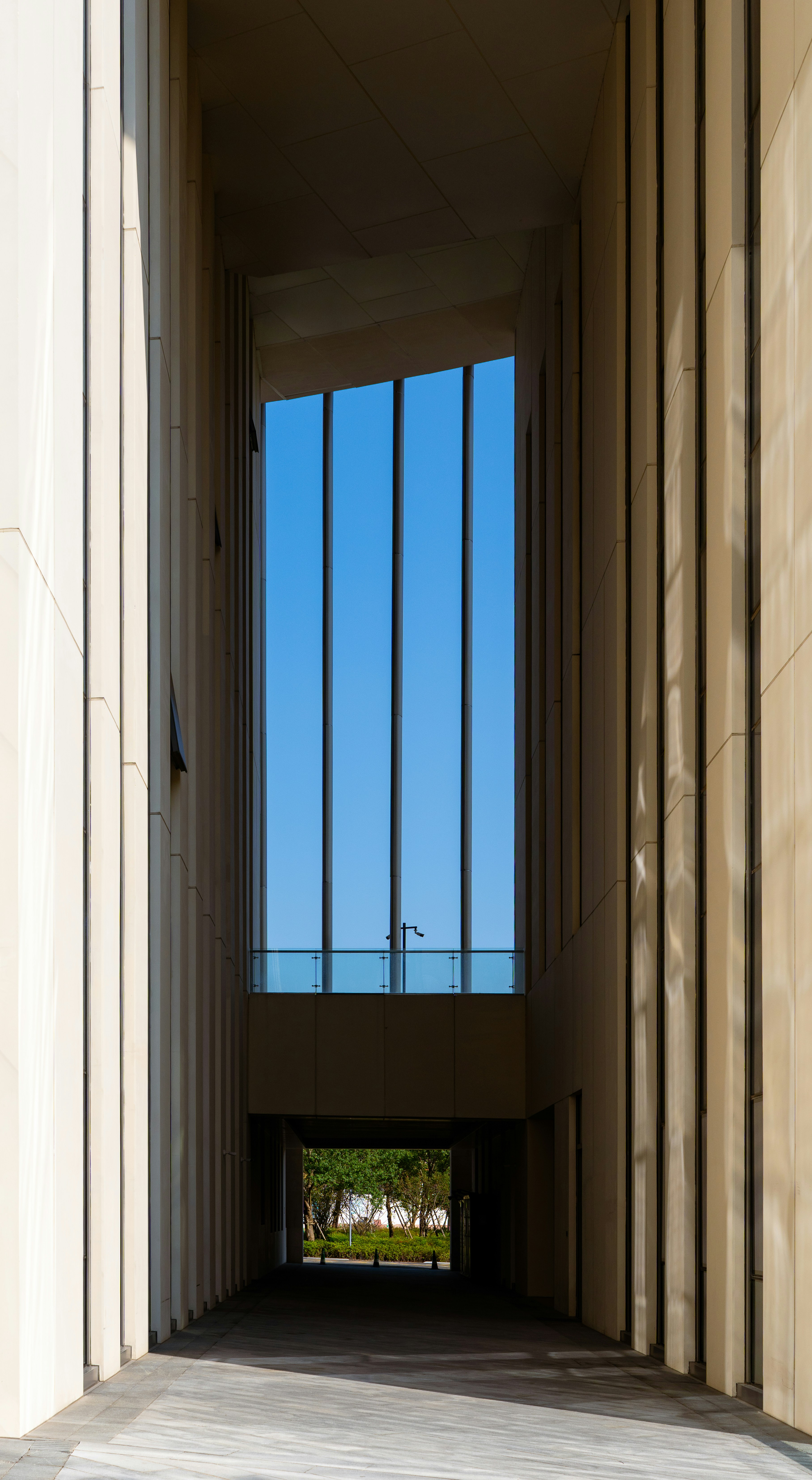 Modern building with tall windows and walkway