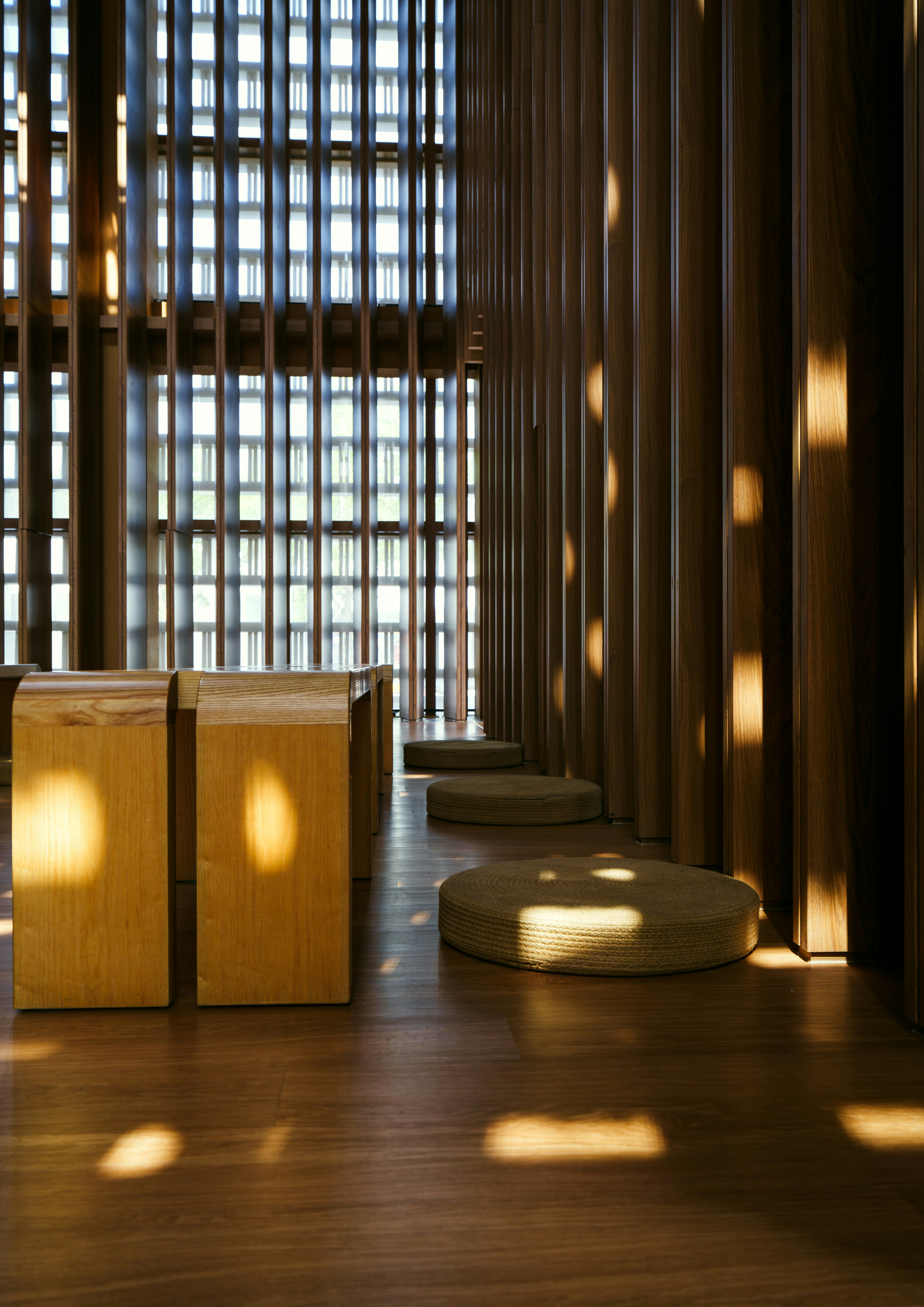 Modern wooden interior with natural light patterns.