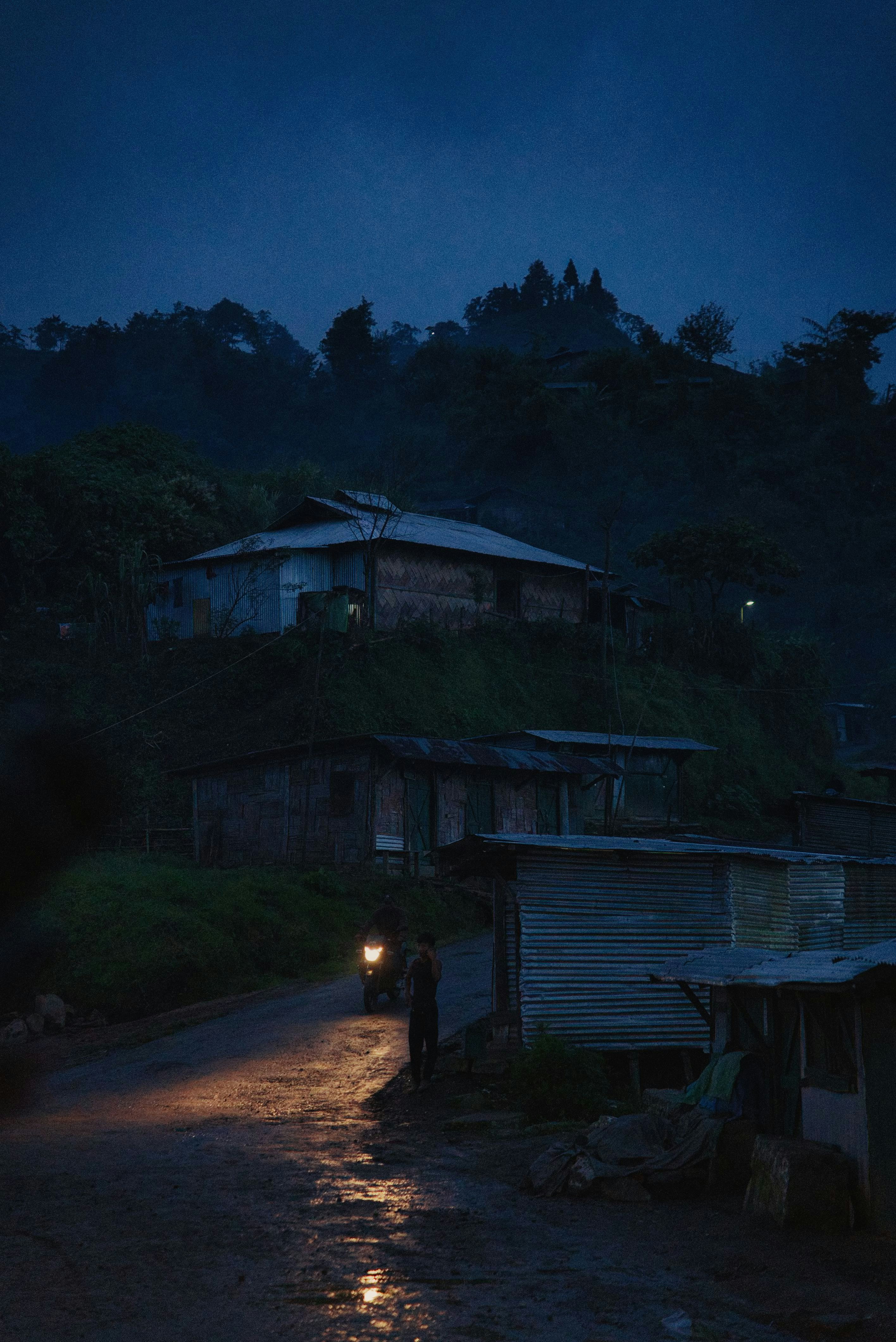 A motorcycle on a wet road at dusk