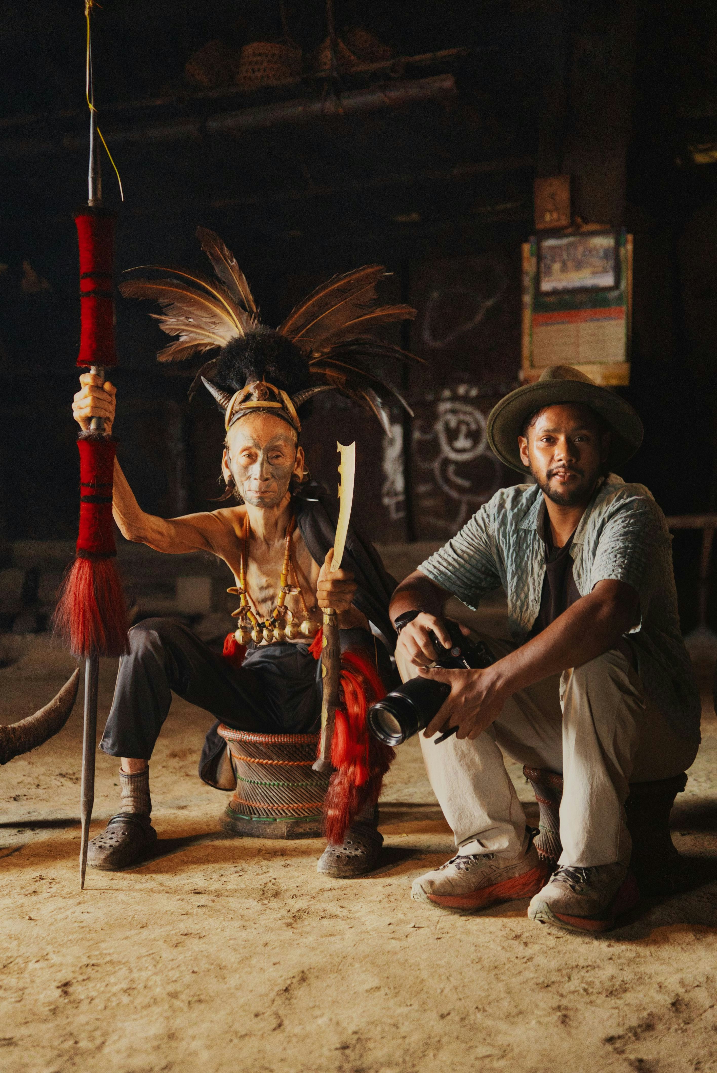 Two men, one in traditional attire, posing together. photo – Free ...