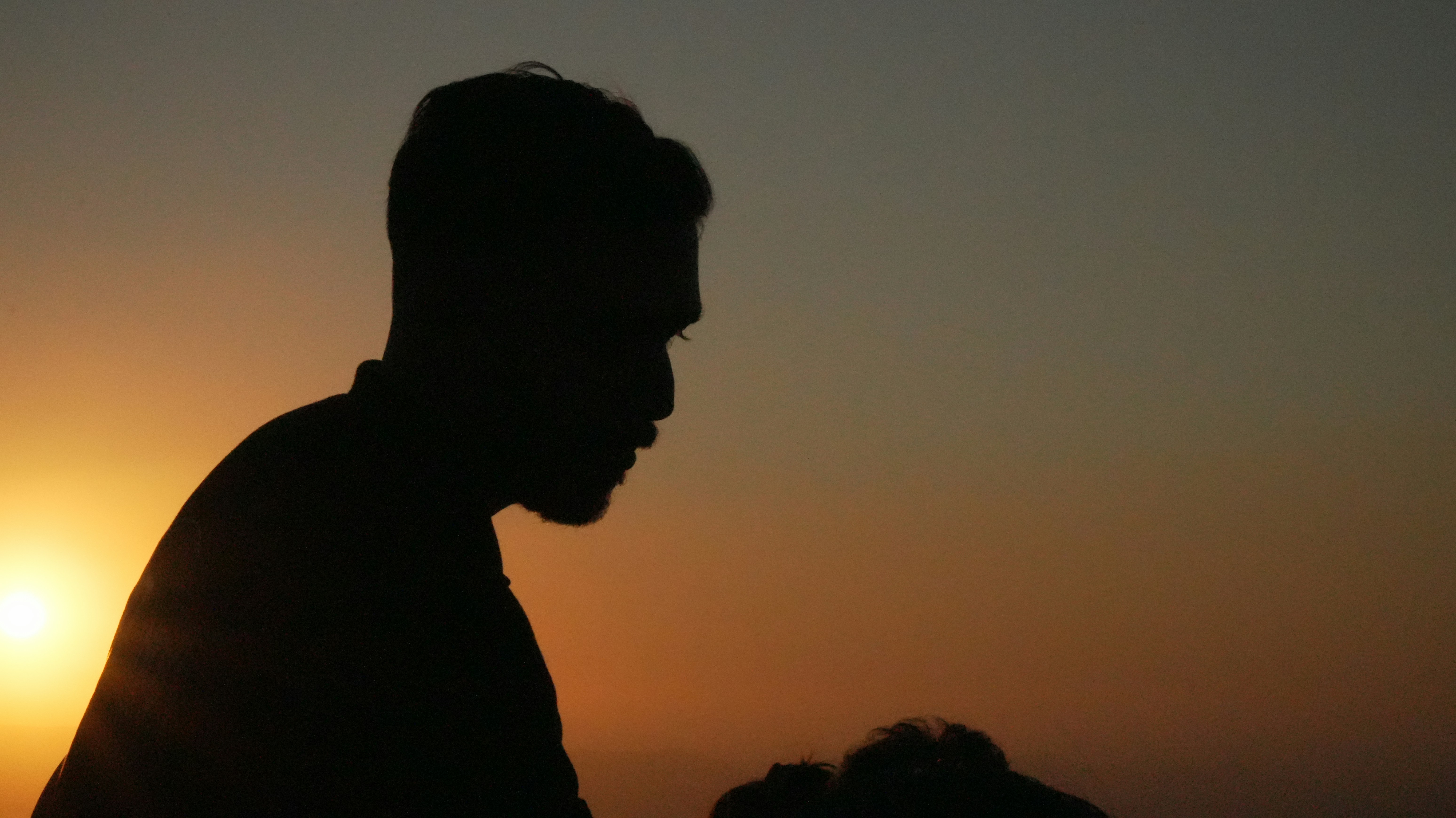 Male Silhouette sunset Mountain View Restaurant Scene | Silhouette of a man against a sunset