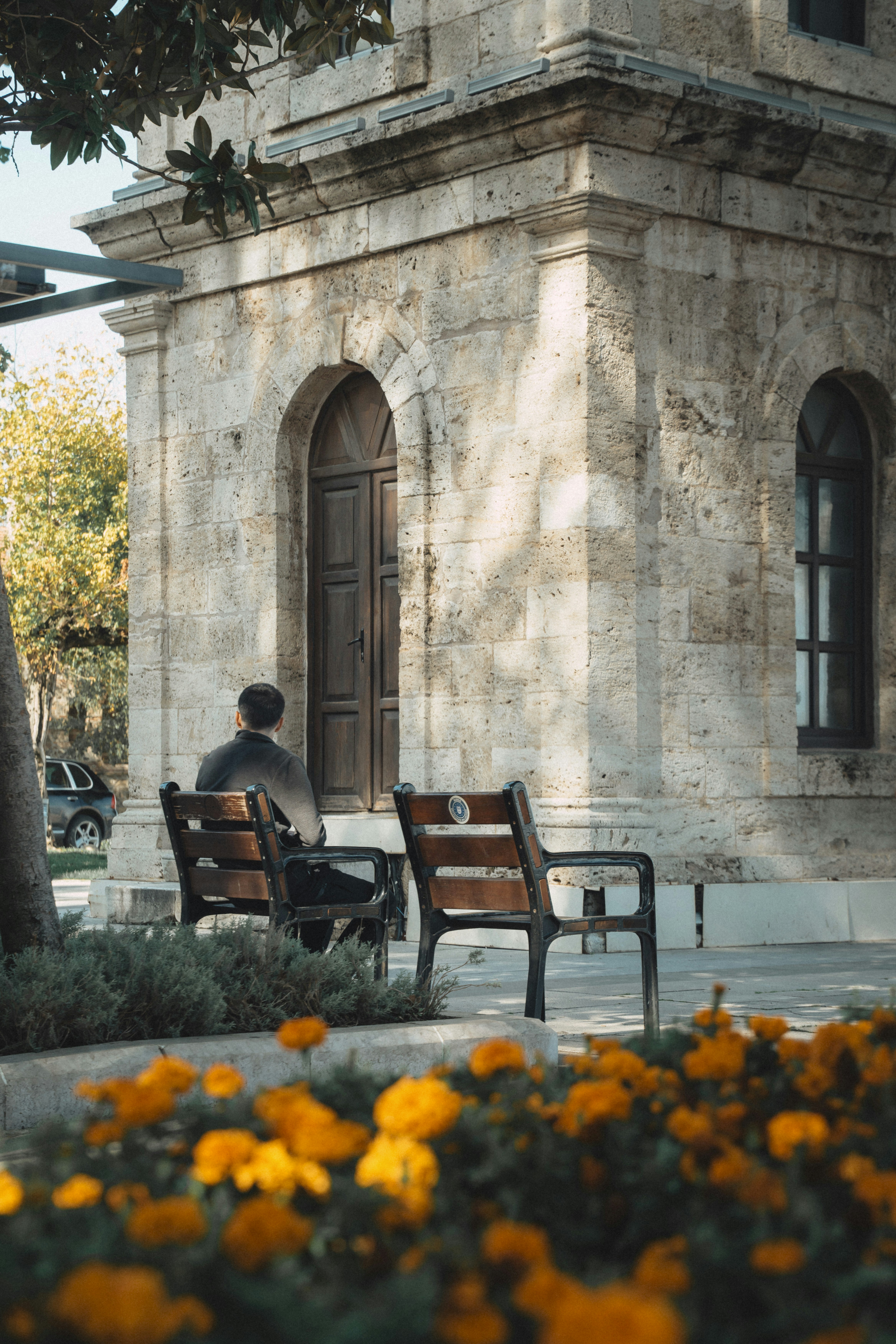 Reflections in Solitude: A Quiet Moment by the Old Stone Facade