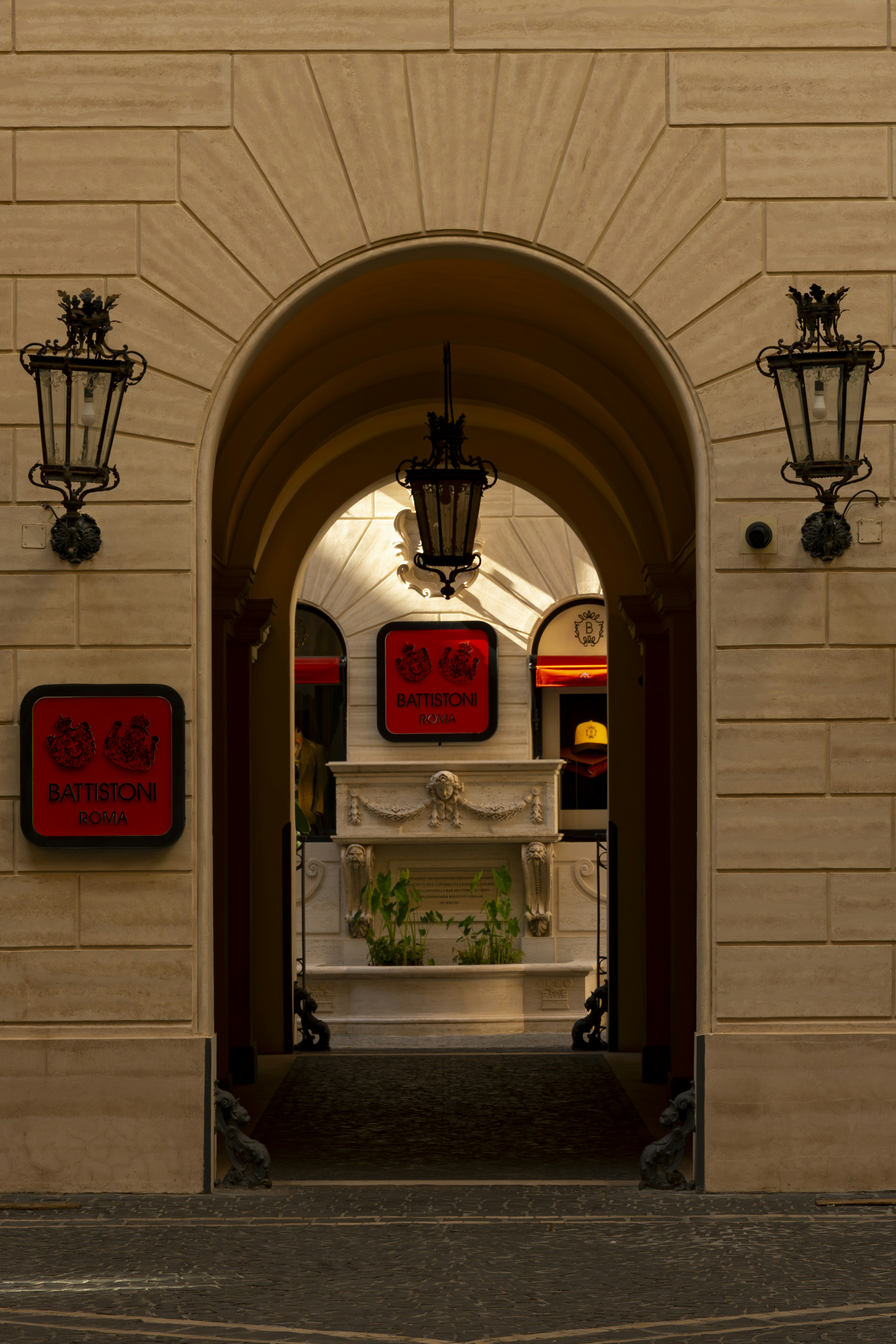 Archway leading to ornate interior with red signs
