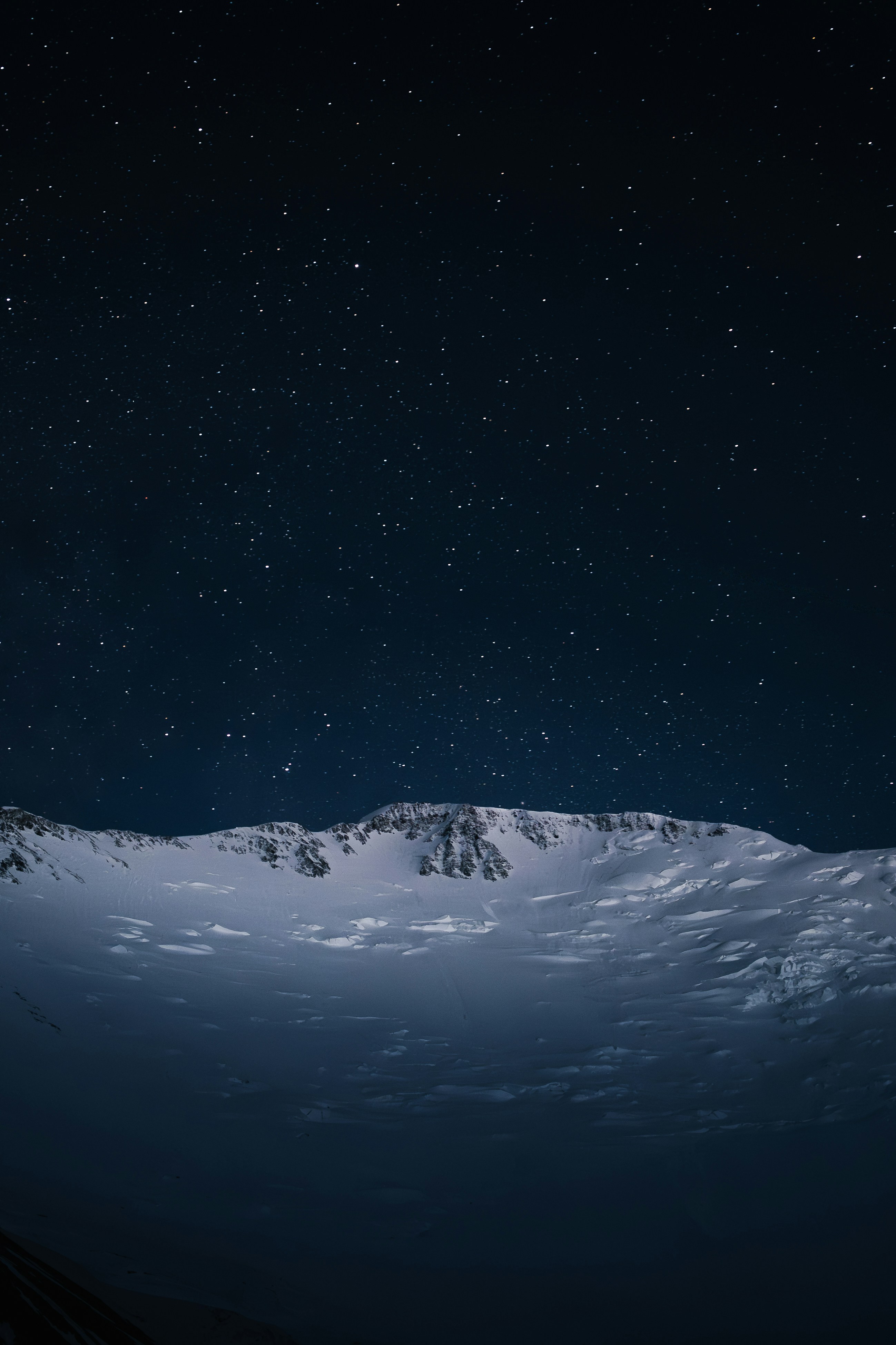 instagram: @auchynnikau | Snowy mountains under a starry night sky