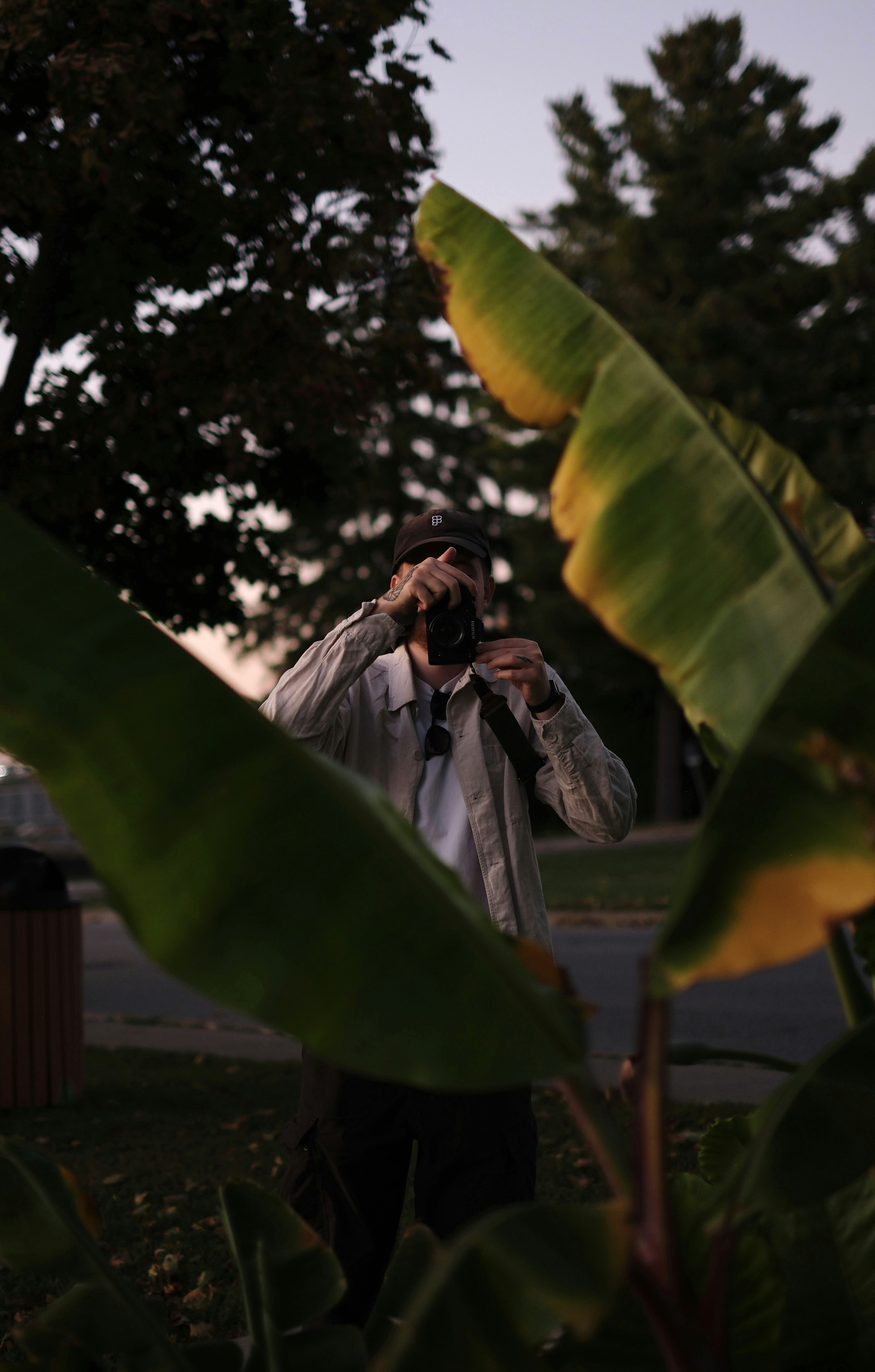 Instagram - @kaprion | Man with camera taking a photo outdoors