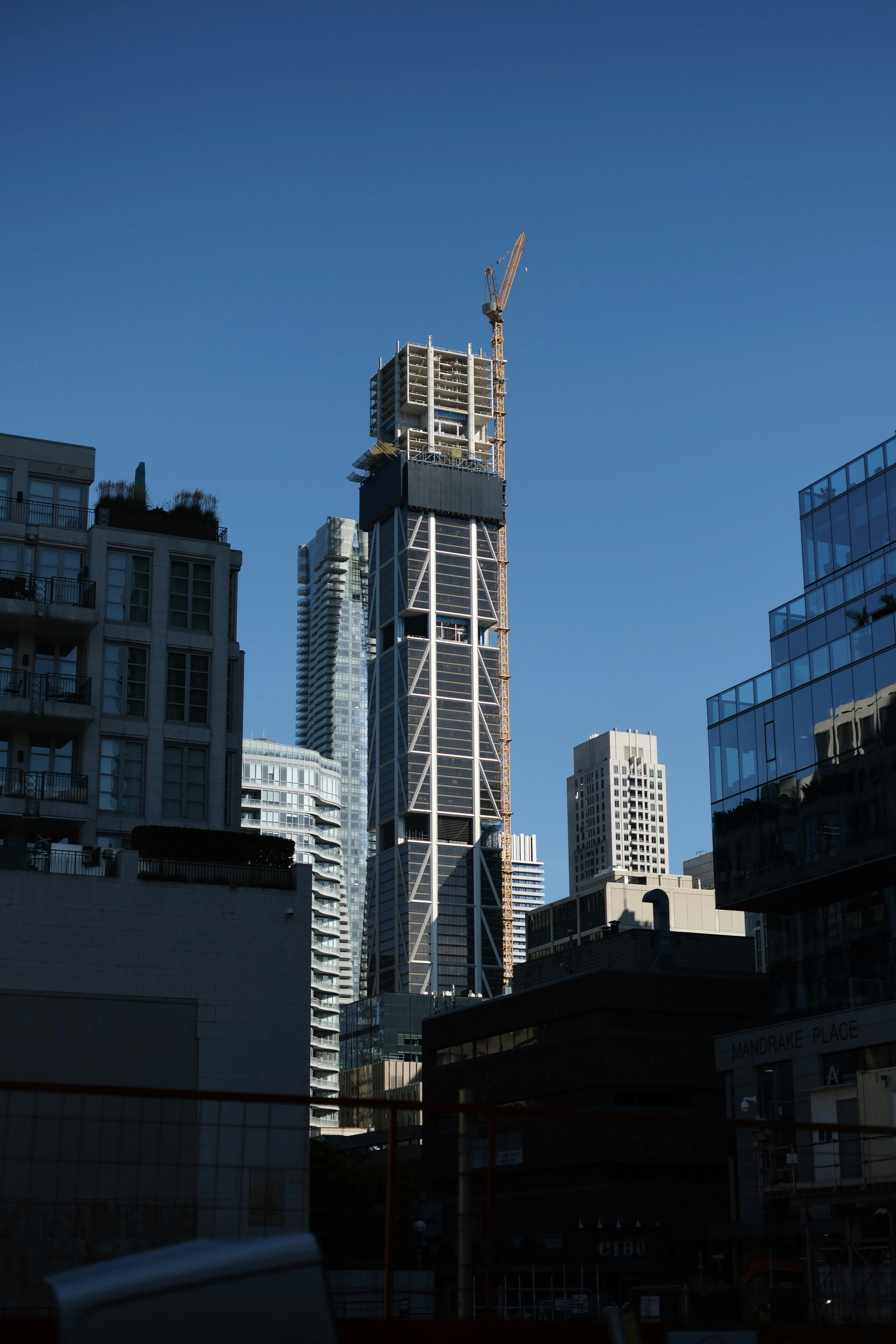 Instagram - @kaprion | Skyscraper under construction against clear blue sky