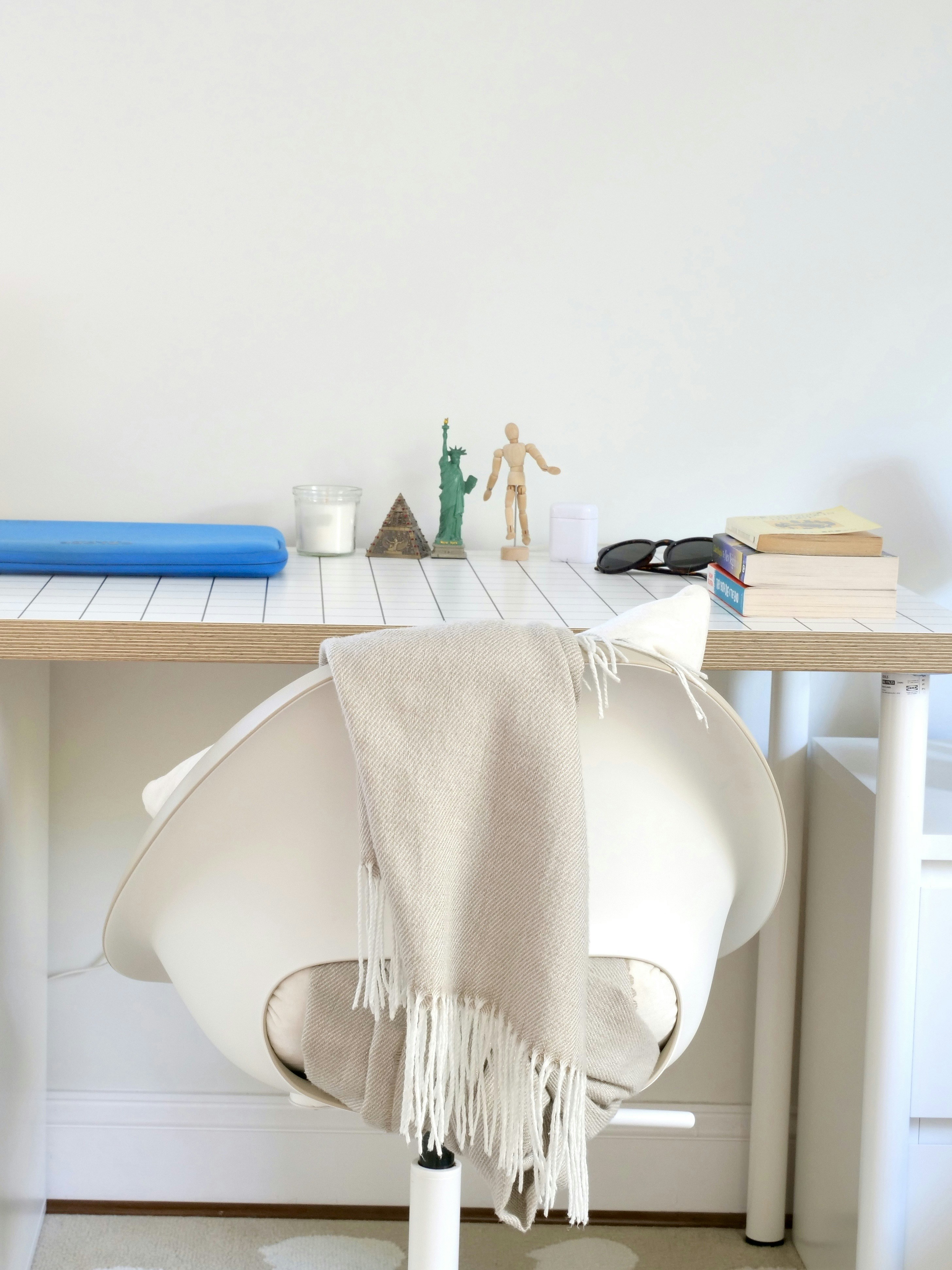 The desk of a teenage girl | Desk with chair and assorted objects on top.