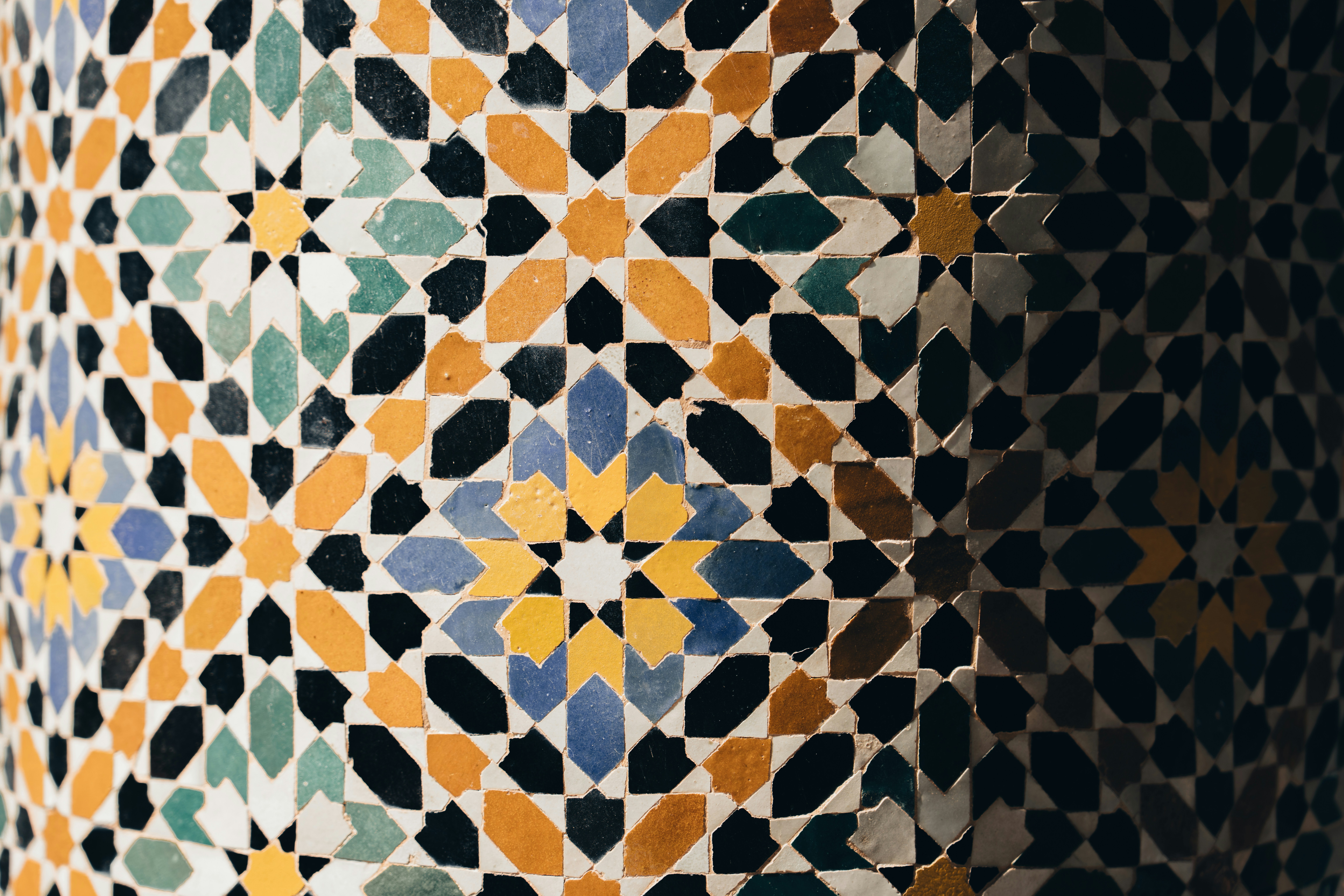 Intricate geometric mosaic tile pattern with vibrant colors.