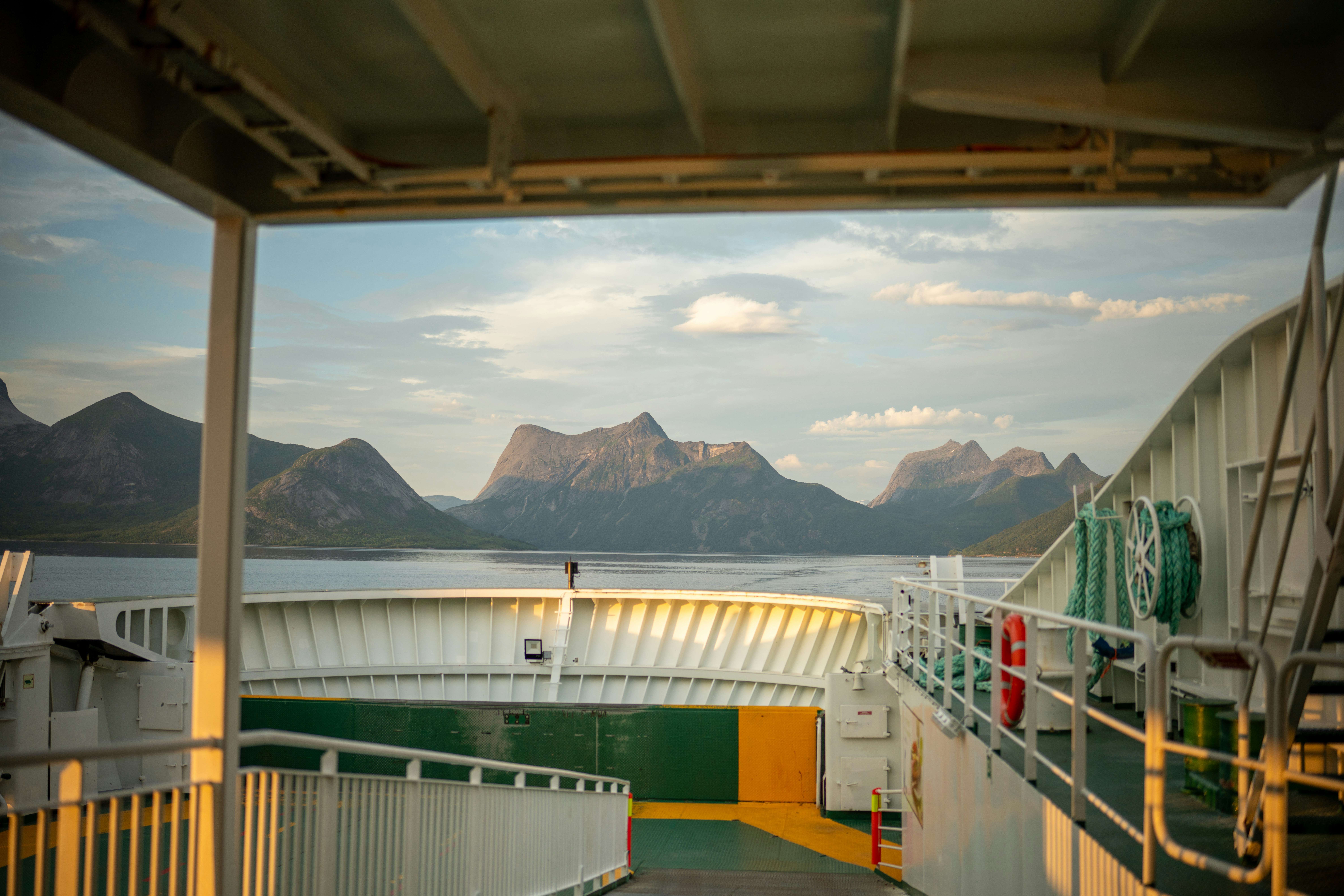 Sunset Ferry Norway | View of mountains from a ferry deck