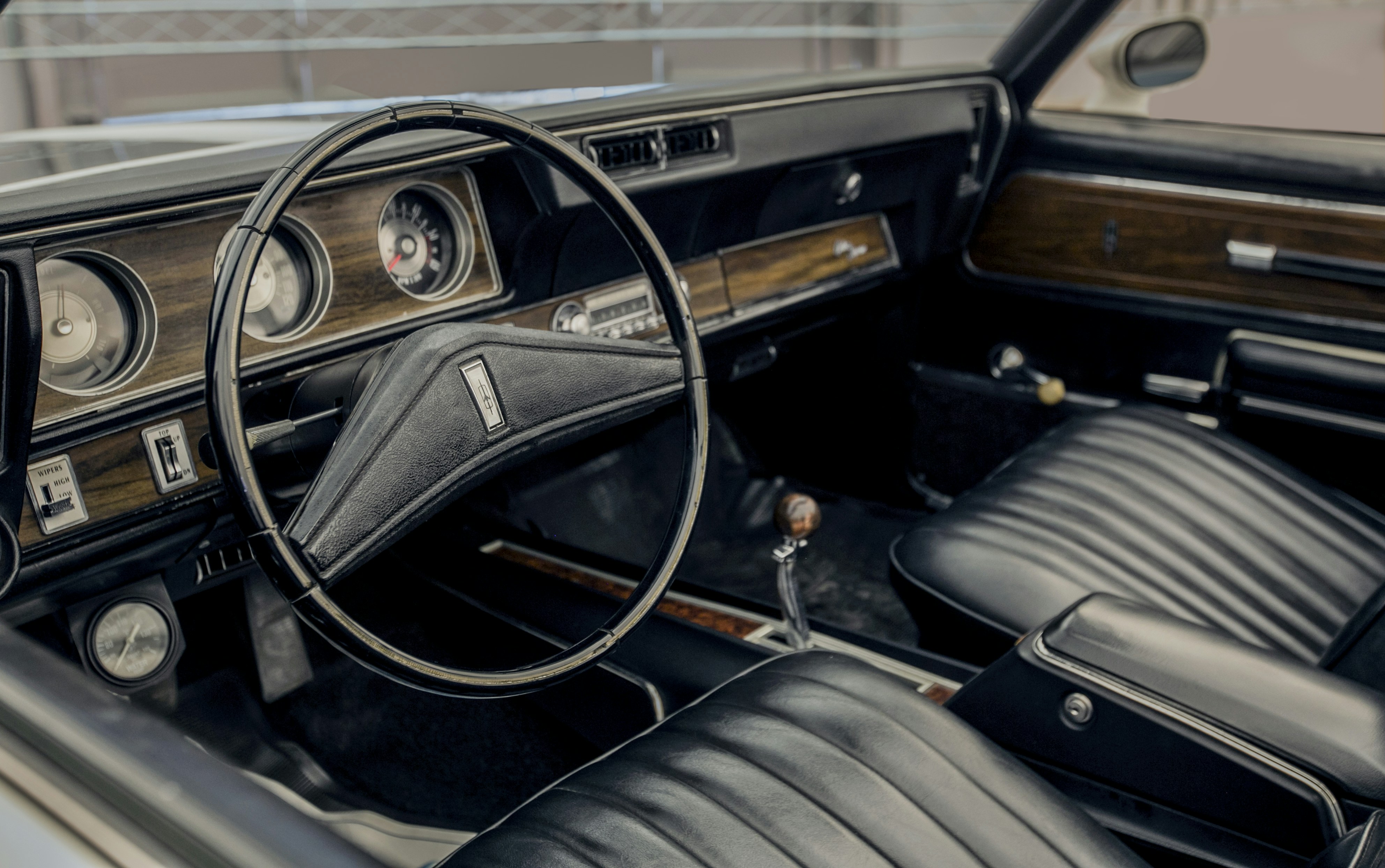 Where time slows down — inside the warm leather and chrome of a classic Cutlass. 🤎🚘 | Interior of a vintage car with leather seats.