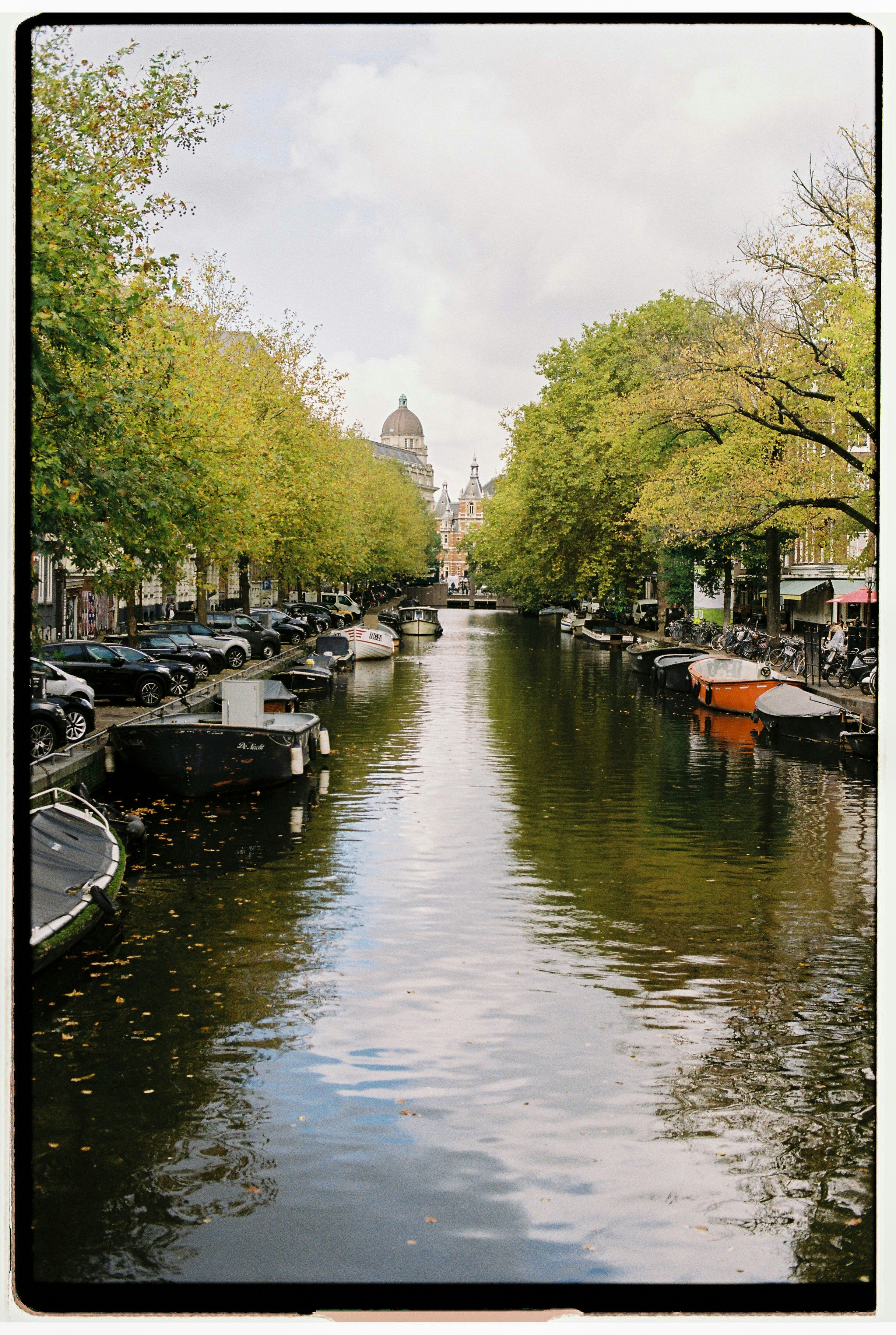 Dome Toward the Waterway: Amsterdam’s Autumn Canal Vista