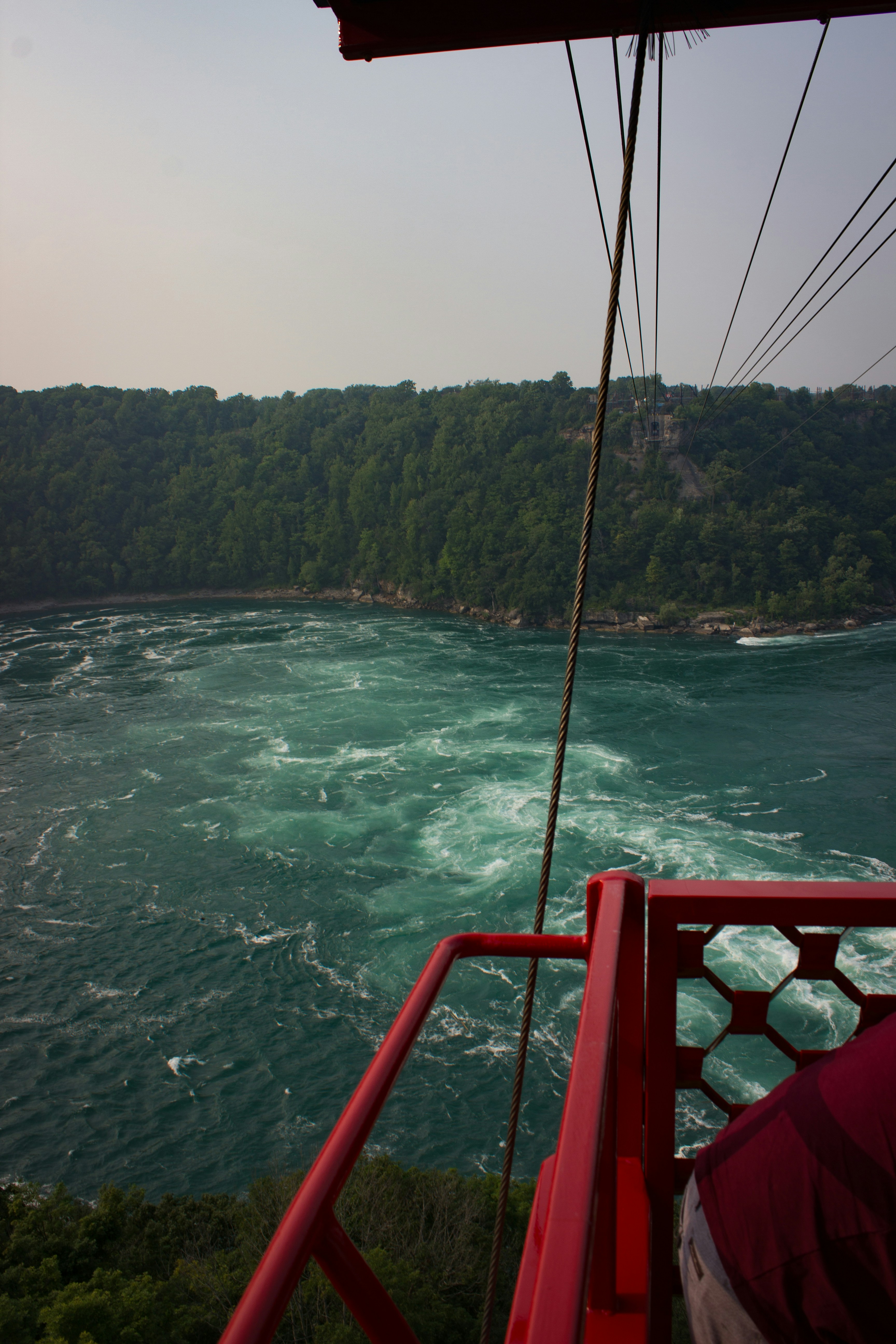 Edge of the Gorge: Red Railing Framing Emerald Currents