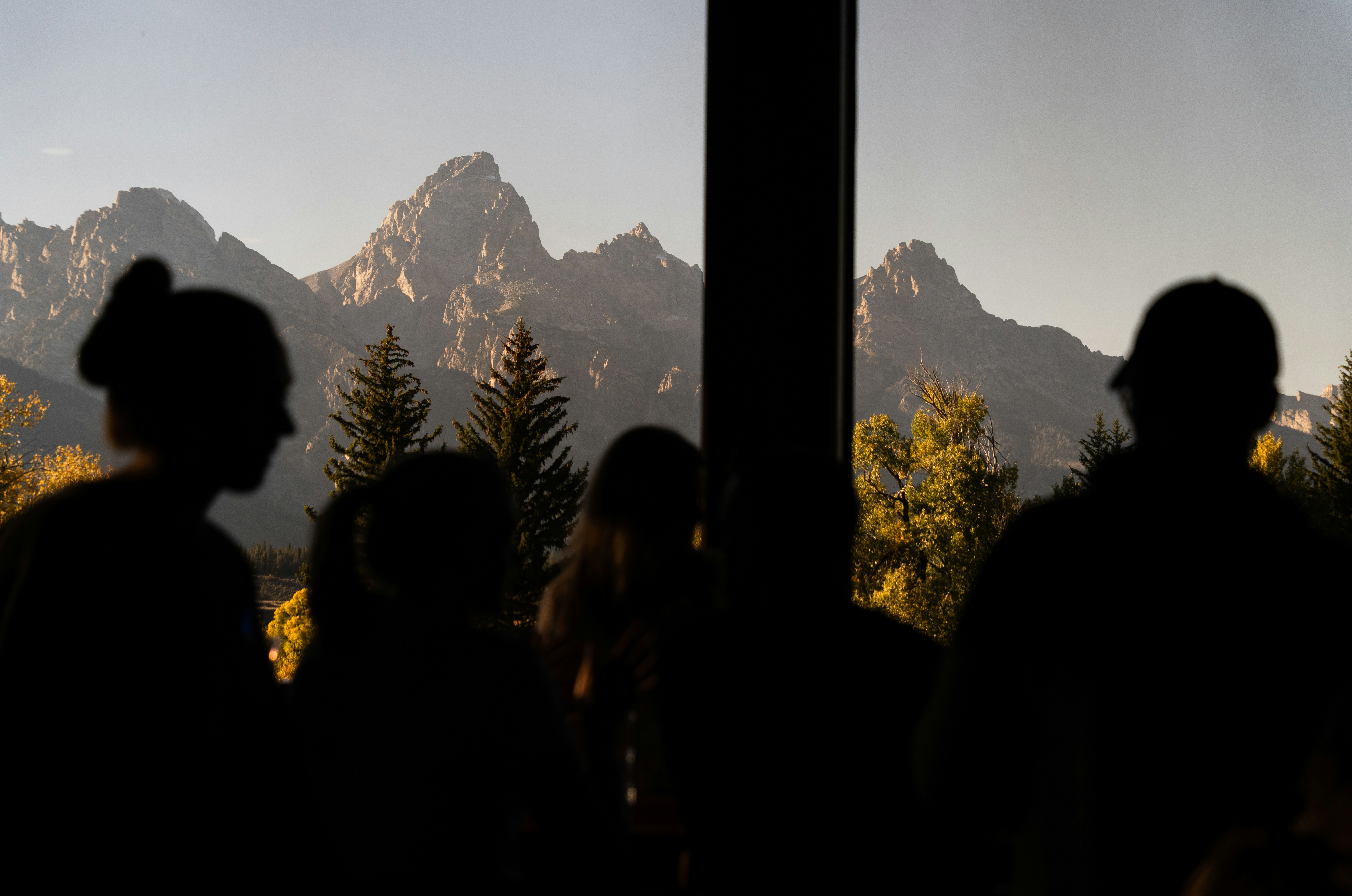 Silhouetted Serenity: A Window to Majestic Peaks