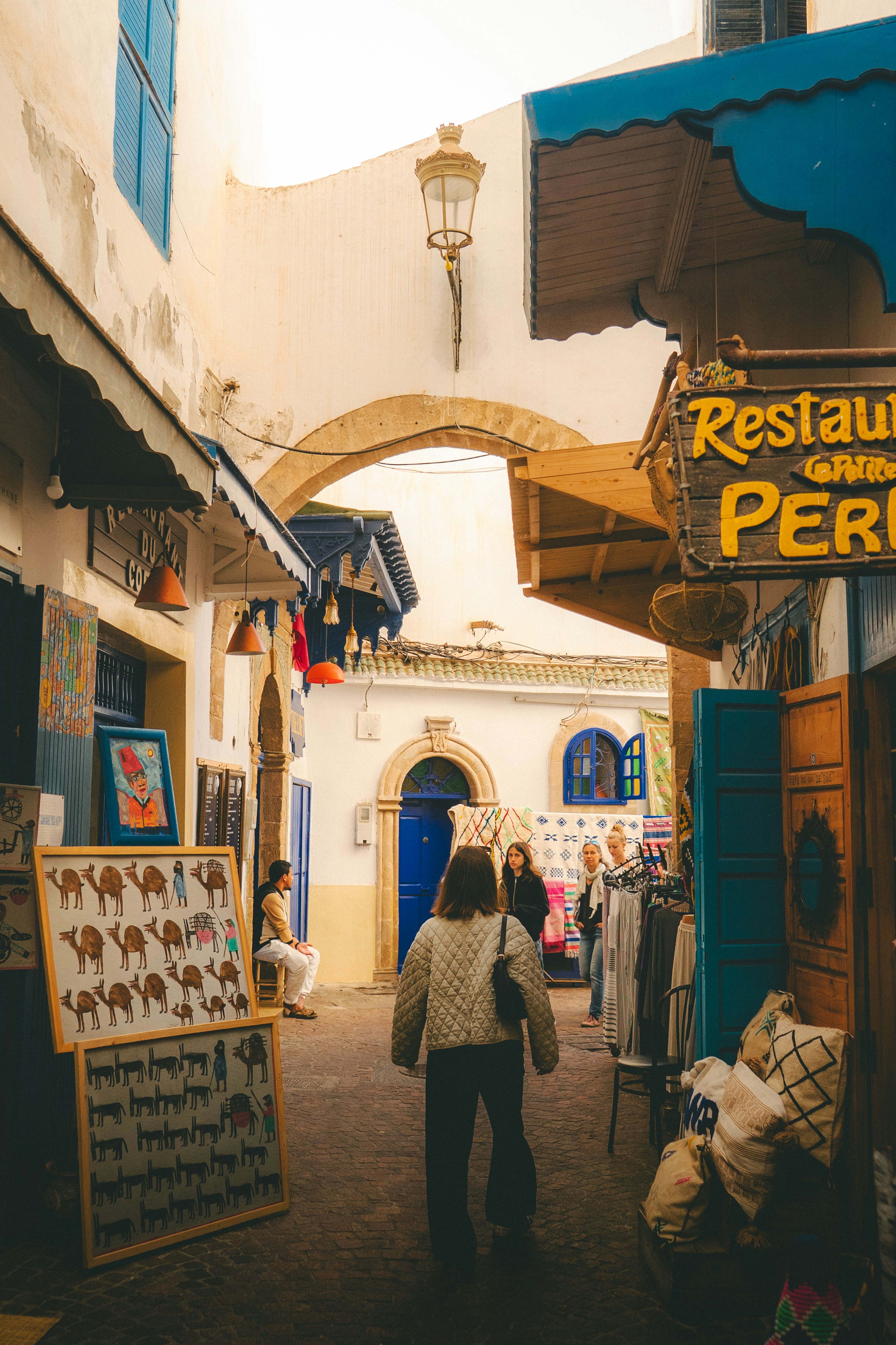 Market Arches and Blue Doors: A Quiet Walk Through a Mediterranean Alley