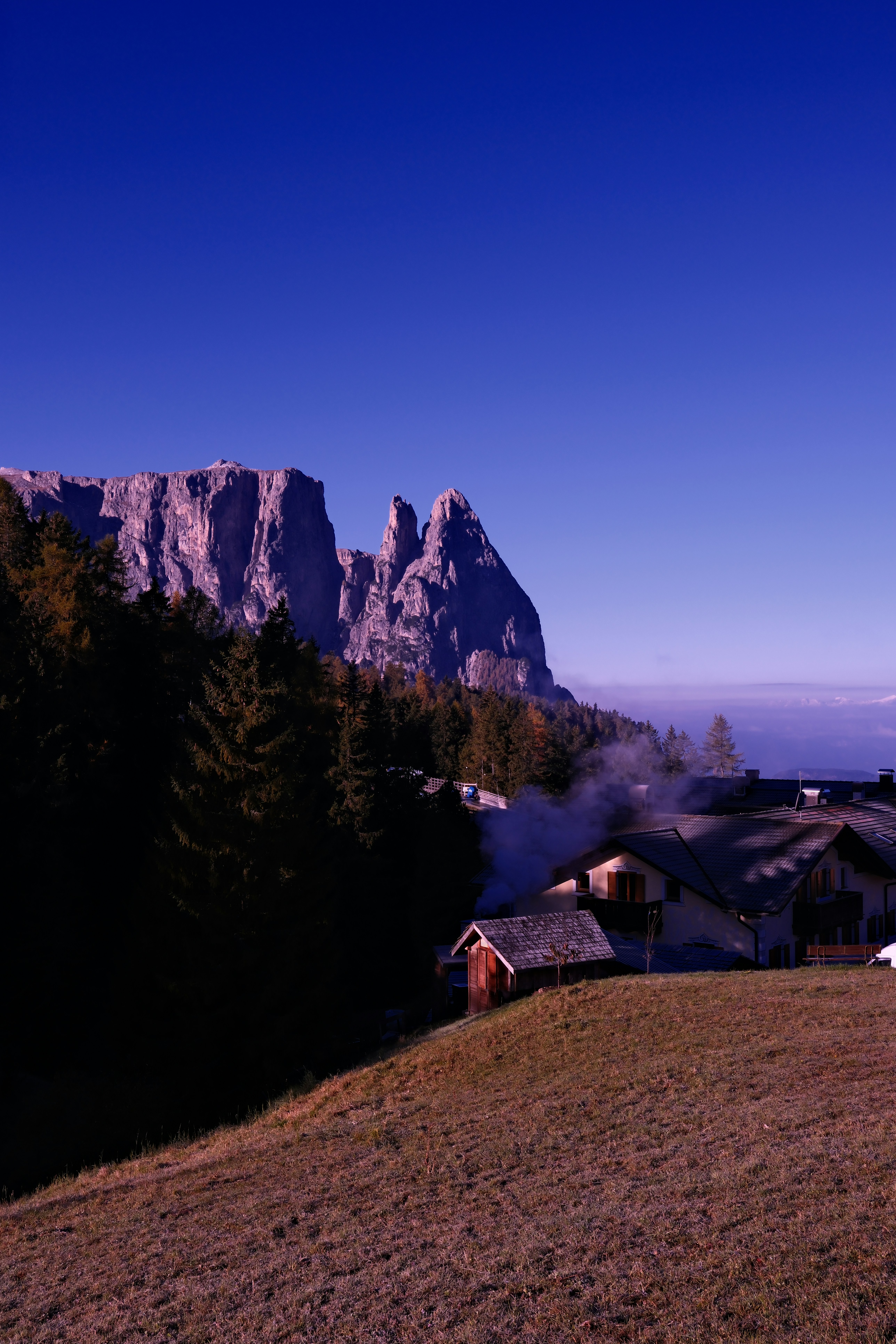 Sentinel Peaks Above Smoke and Pine
