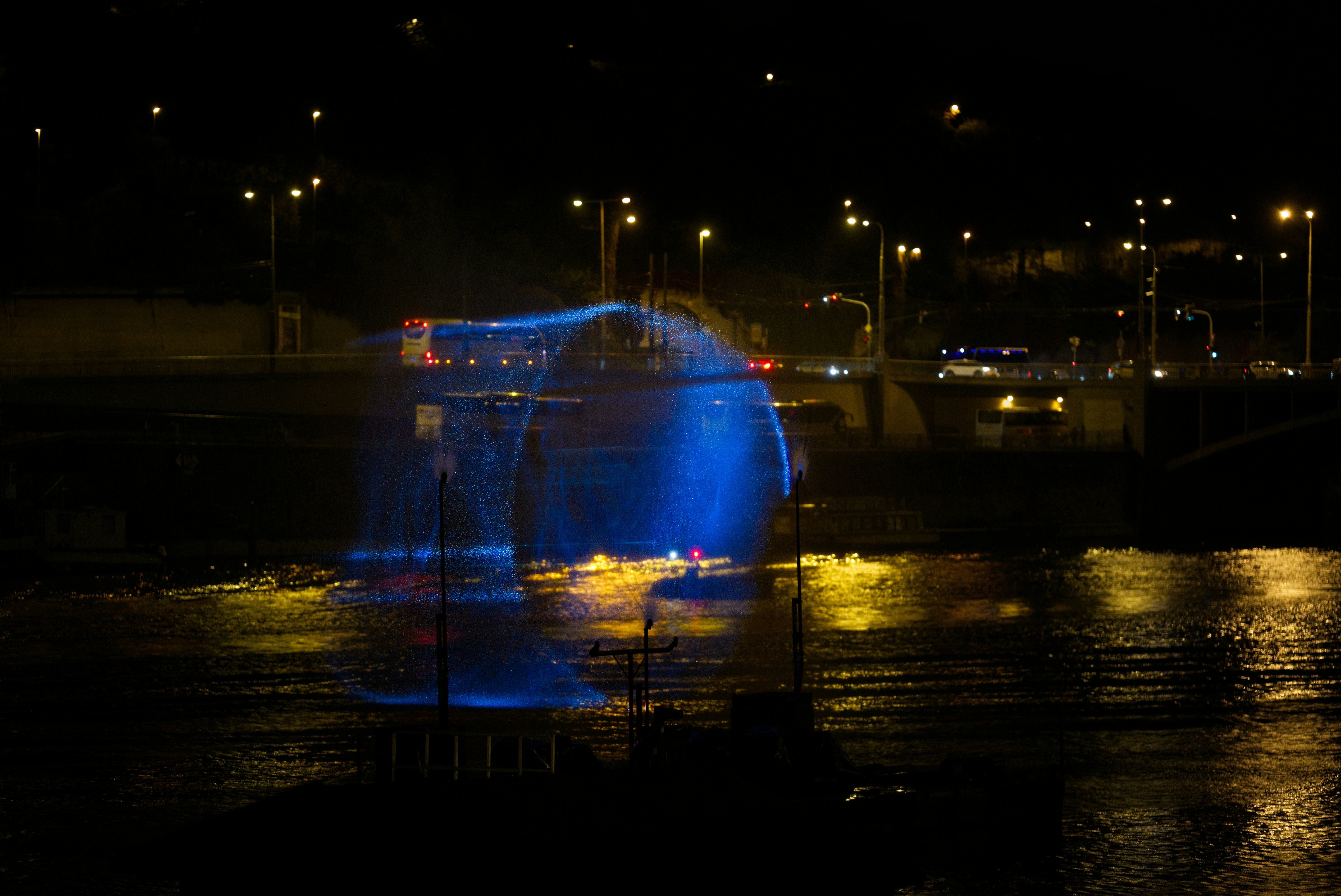 Blue Ring on the River: Night Scene with a Hypnotic Light Sculpture