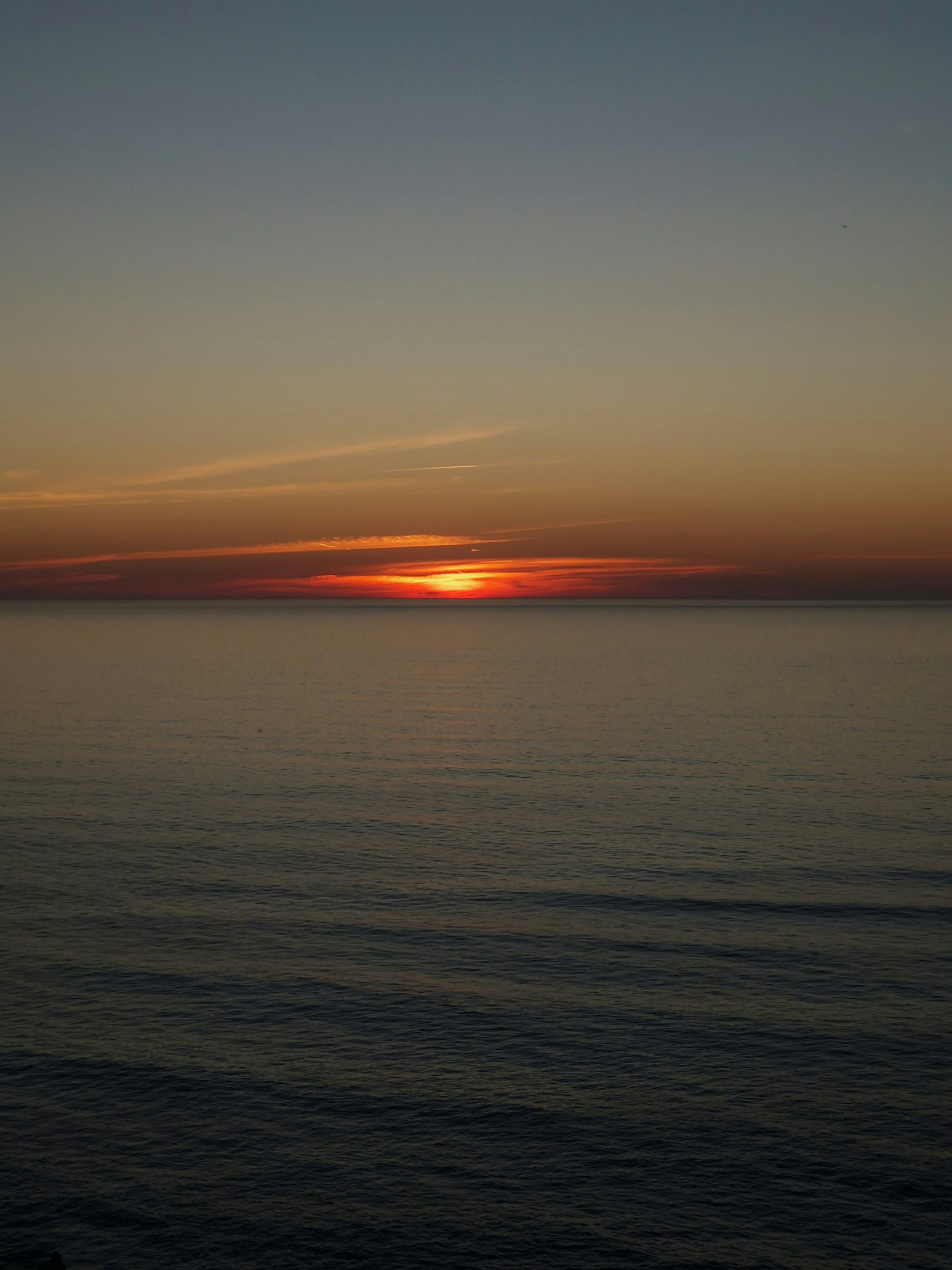 Sunset over a calm ocean