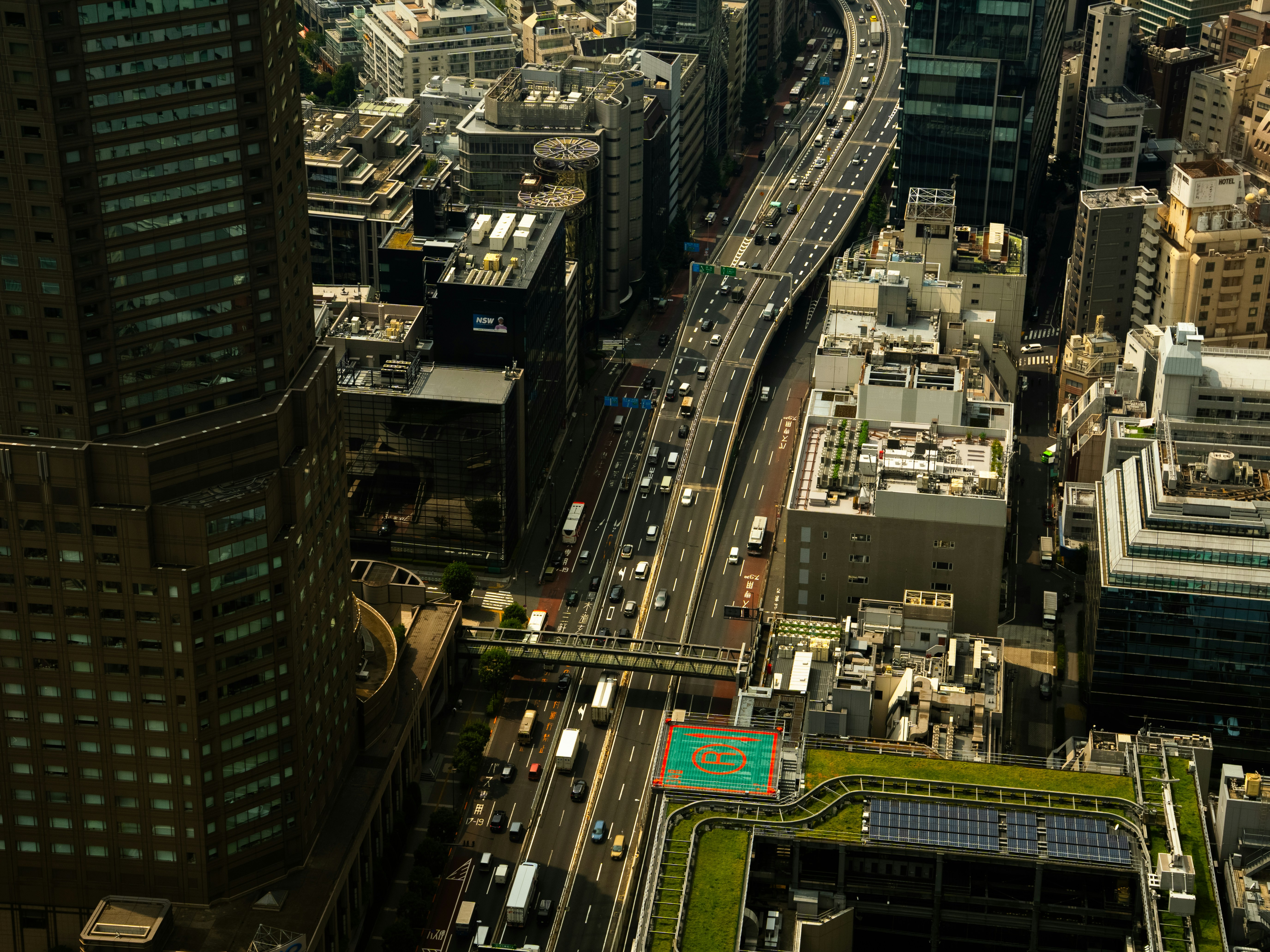 Tokyo highway | Busy highway traffic amidst tall city buildings