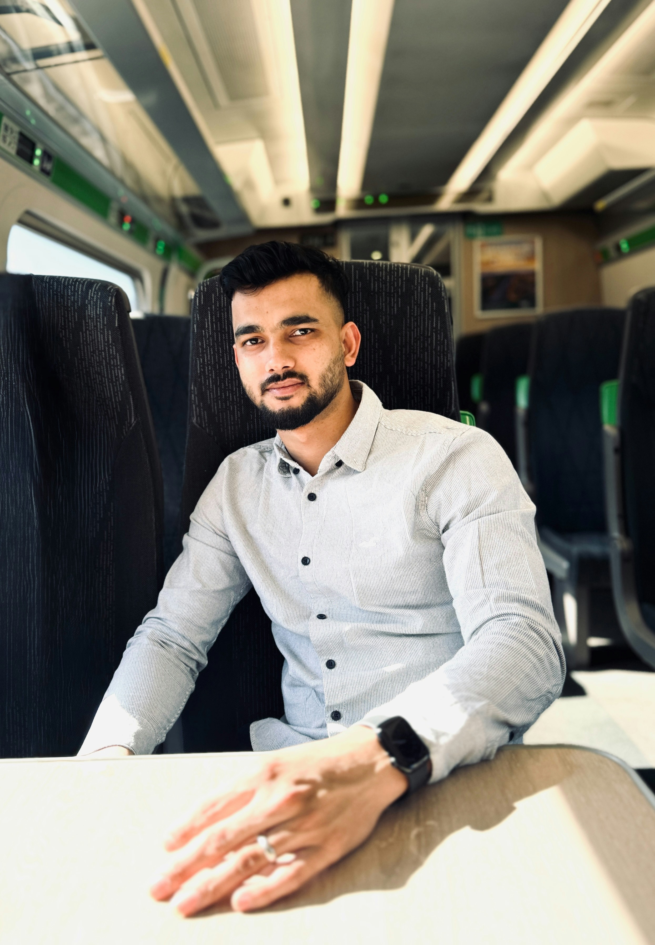 Rail-Car Quiet: A Portrait of Focus Under Fluorescent Light
