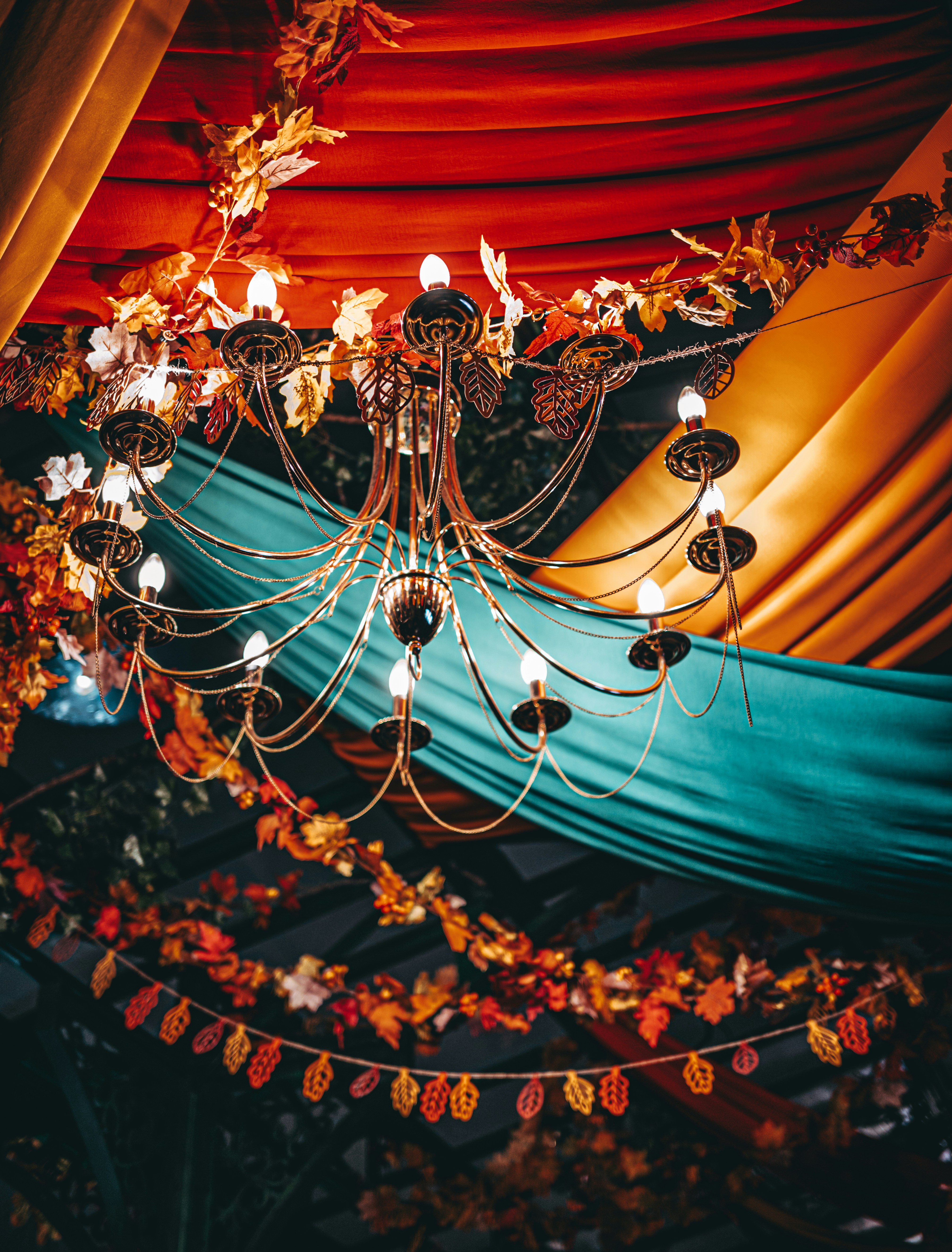 Illuminated Elegance: A Chandelier's Autumn Embrace