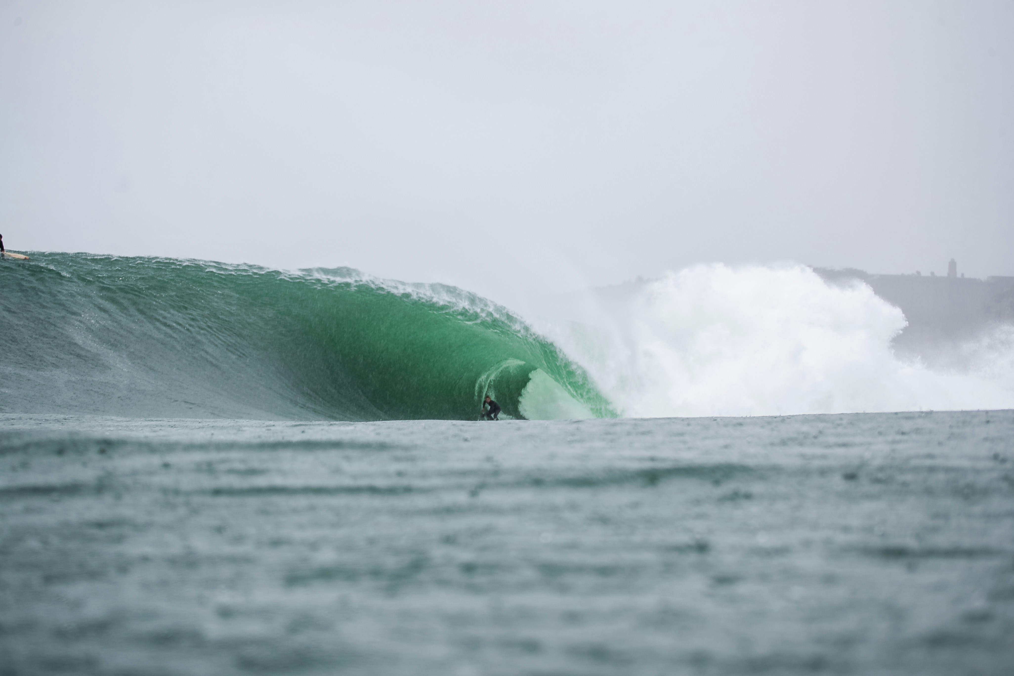 Surfer rides a powerful green wave barrel. photo – Free Sea Image on ...