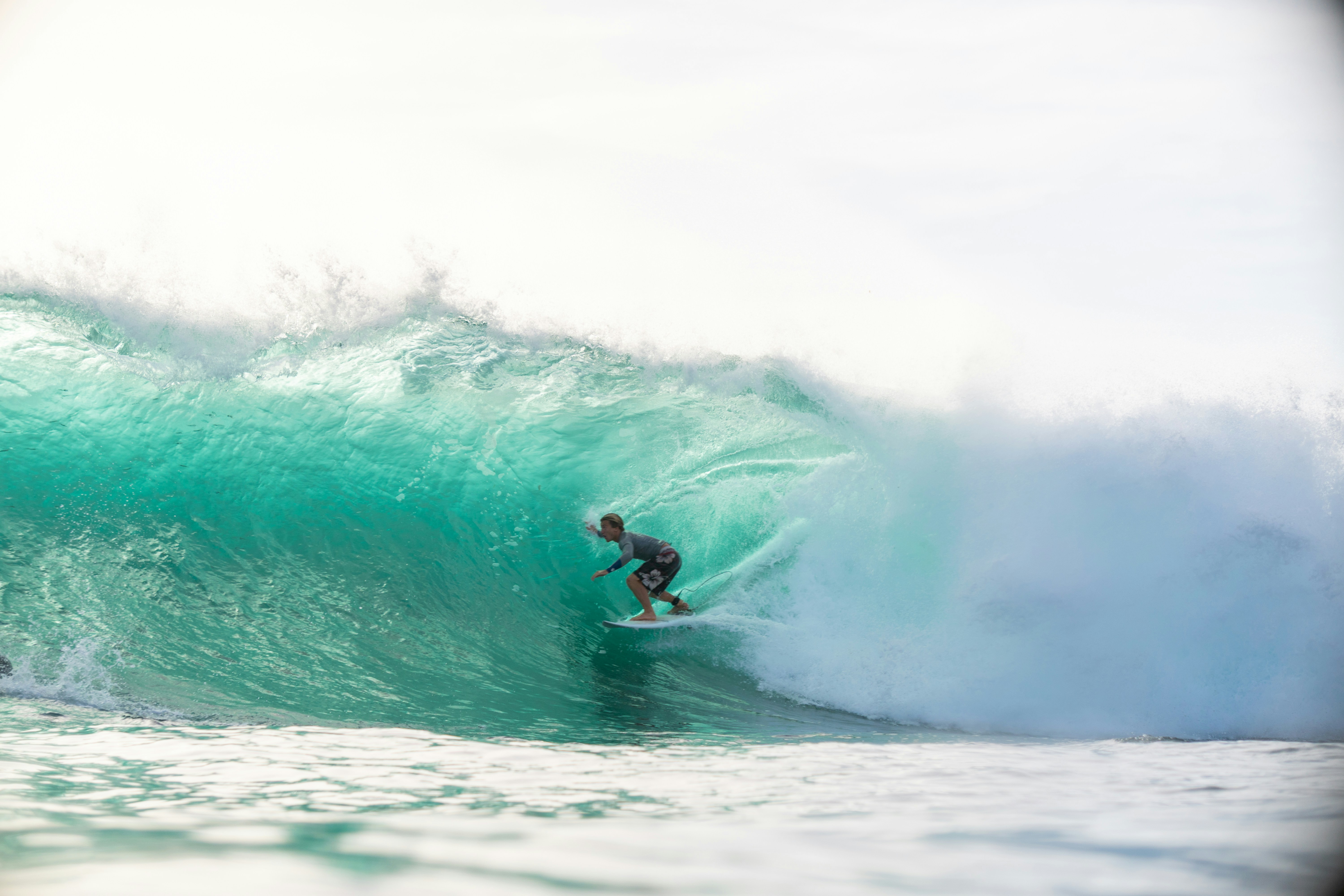 Ridge of Emerald Mist: Surfer in a Turquoise Barrel