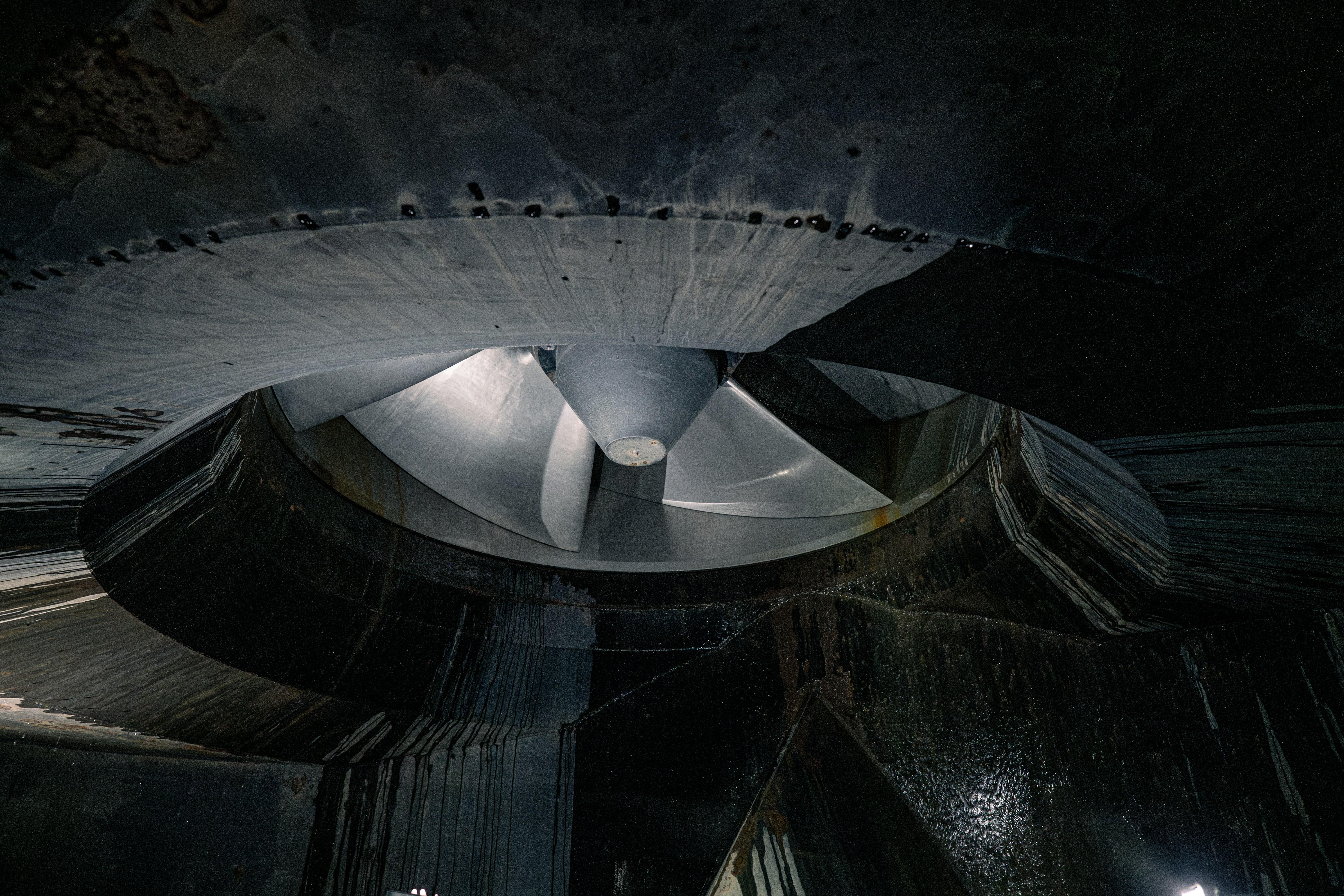 Massive industrial turbine or pump in dark space