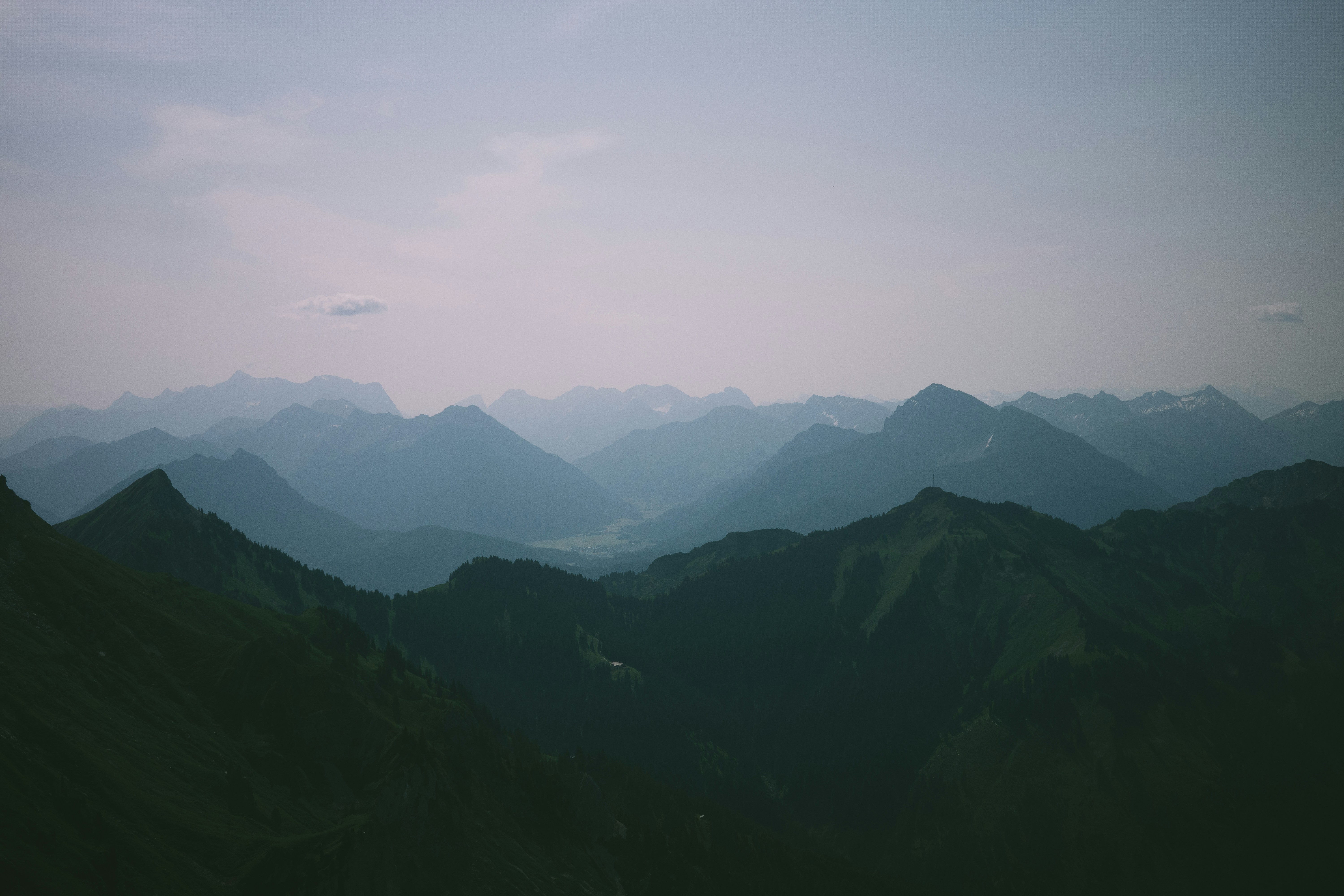 Veils of Mist Over Majestic Peaks
