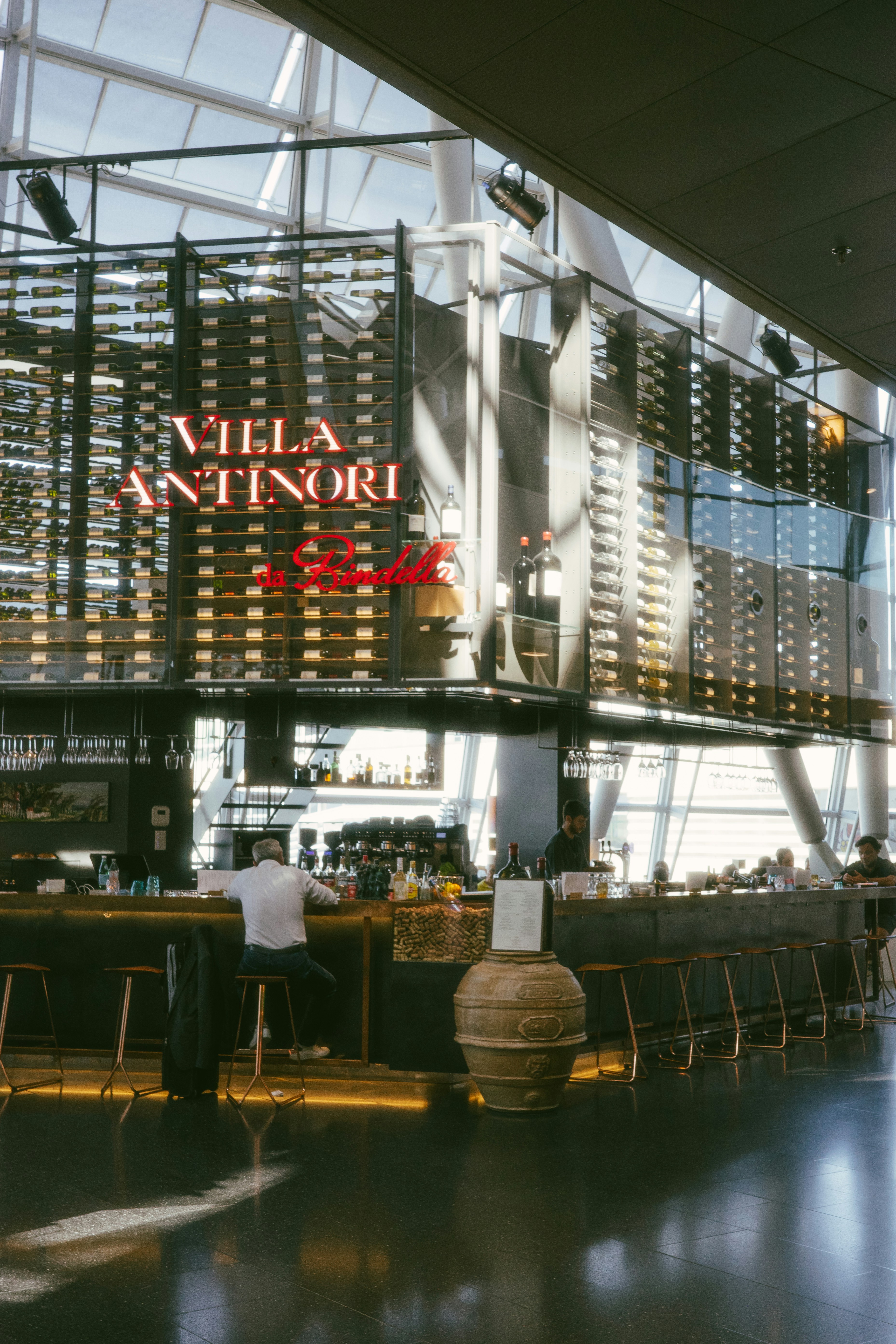 Modern bar with extensive wine display and spirit collection