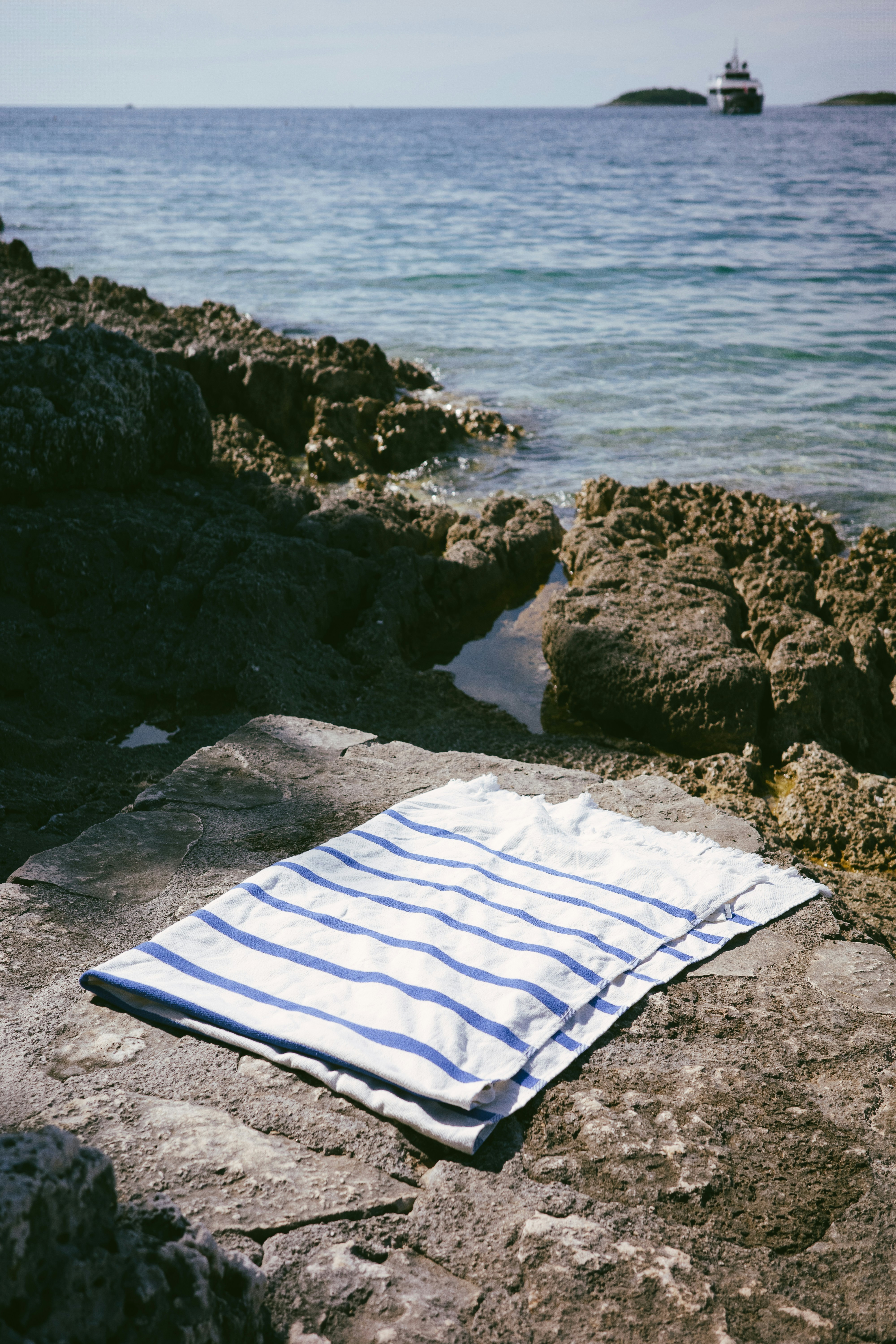 Serene Coastal Retreat: A Towel's Solitude