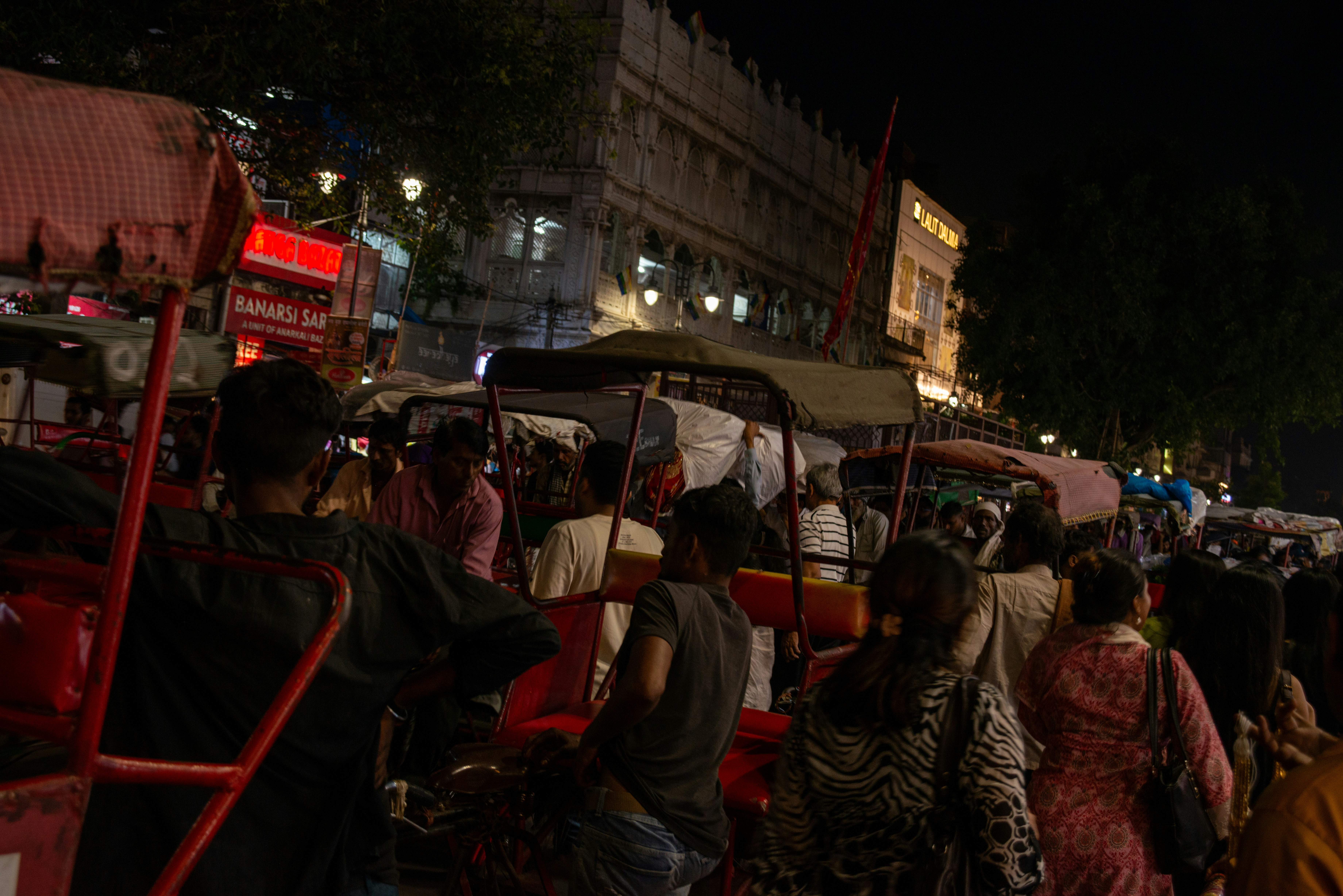 Crimson Frames and Crowded Aisles: Night Market in Motion