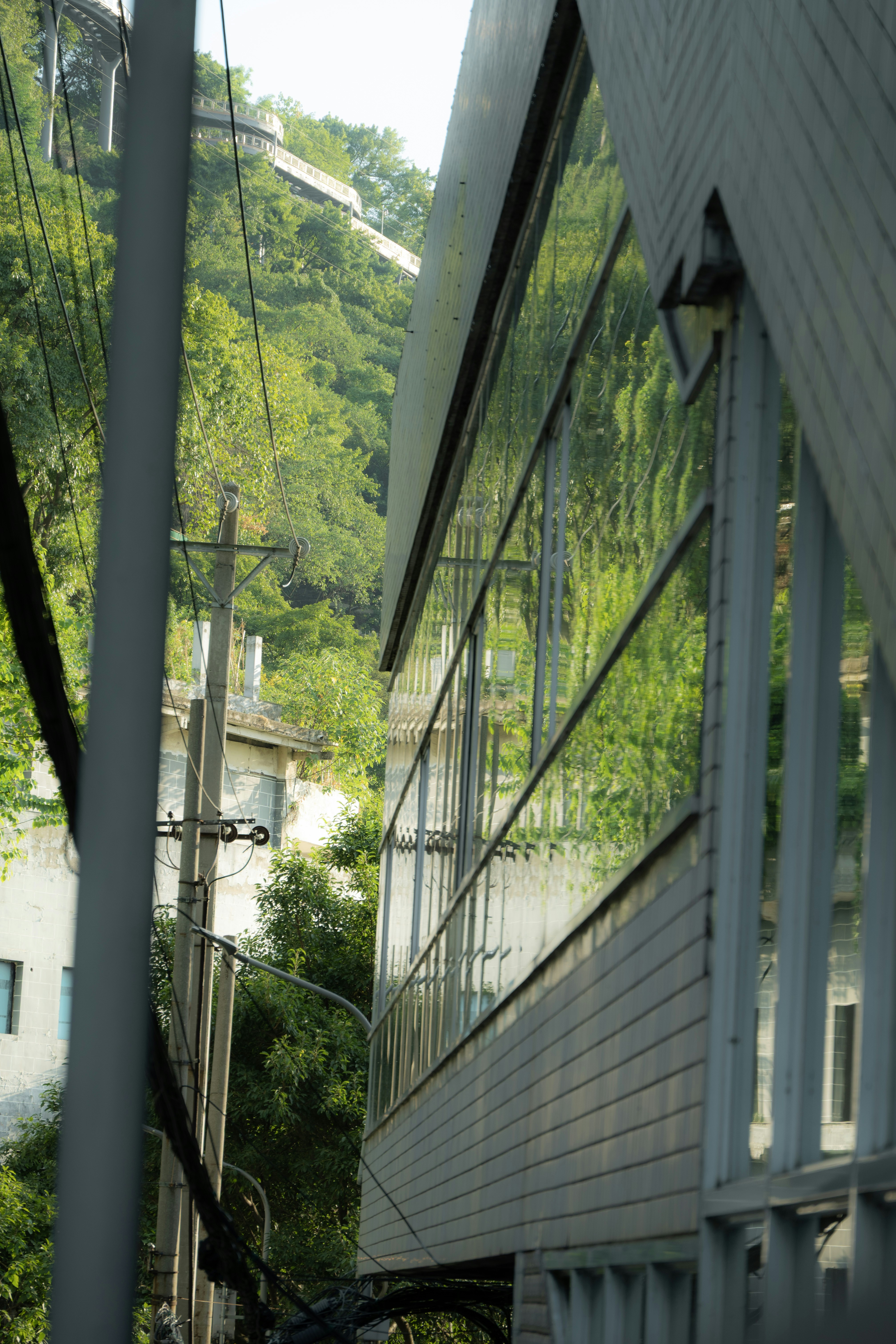 Modern building with reflections on glass facade.