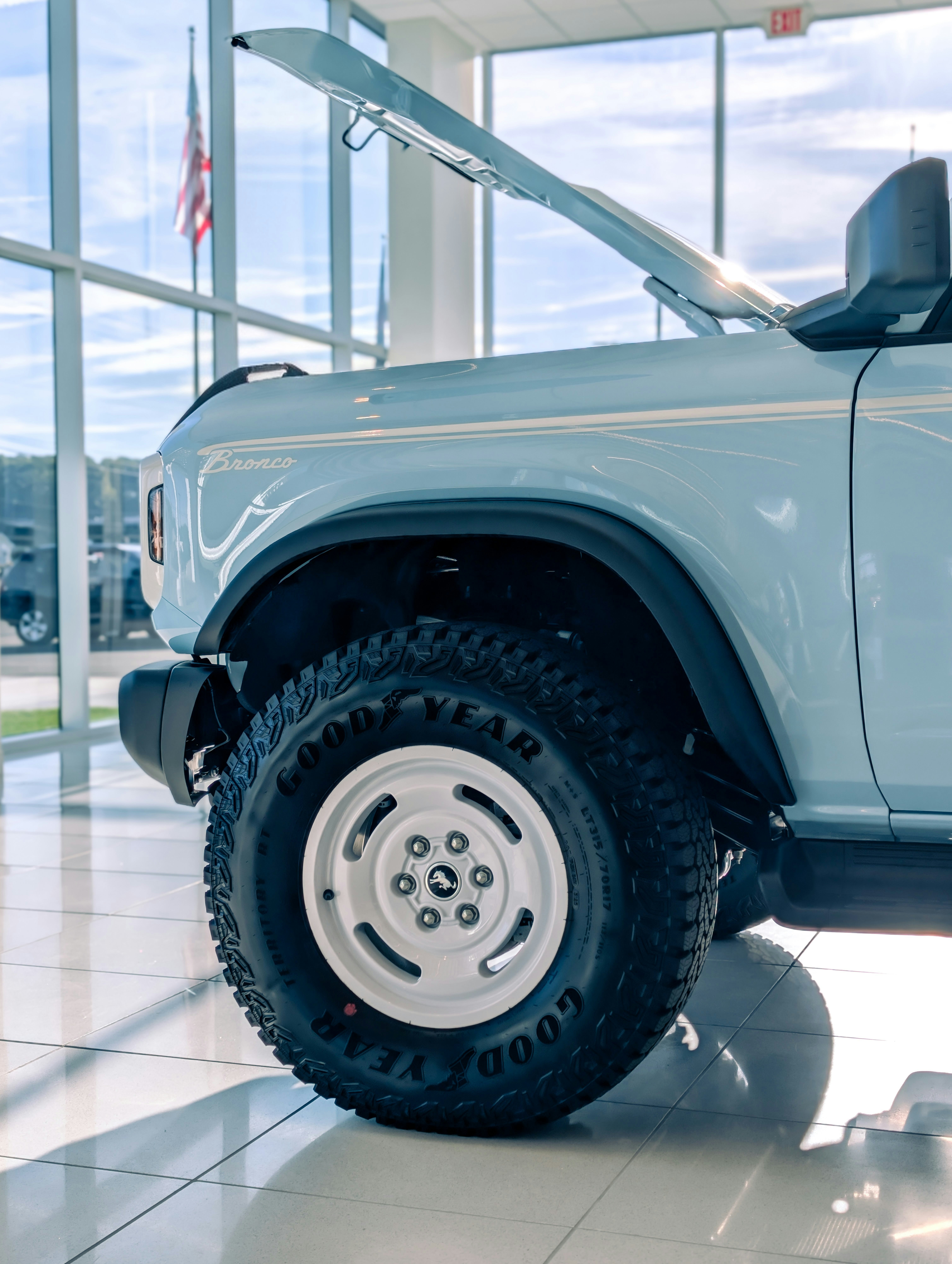 The details on this Bronco are simply magnificent! From the classic white wheel to the rugged Goodyear tire, every element screams quality craftsmanship and a readiness for grand adventures.