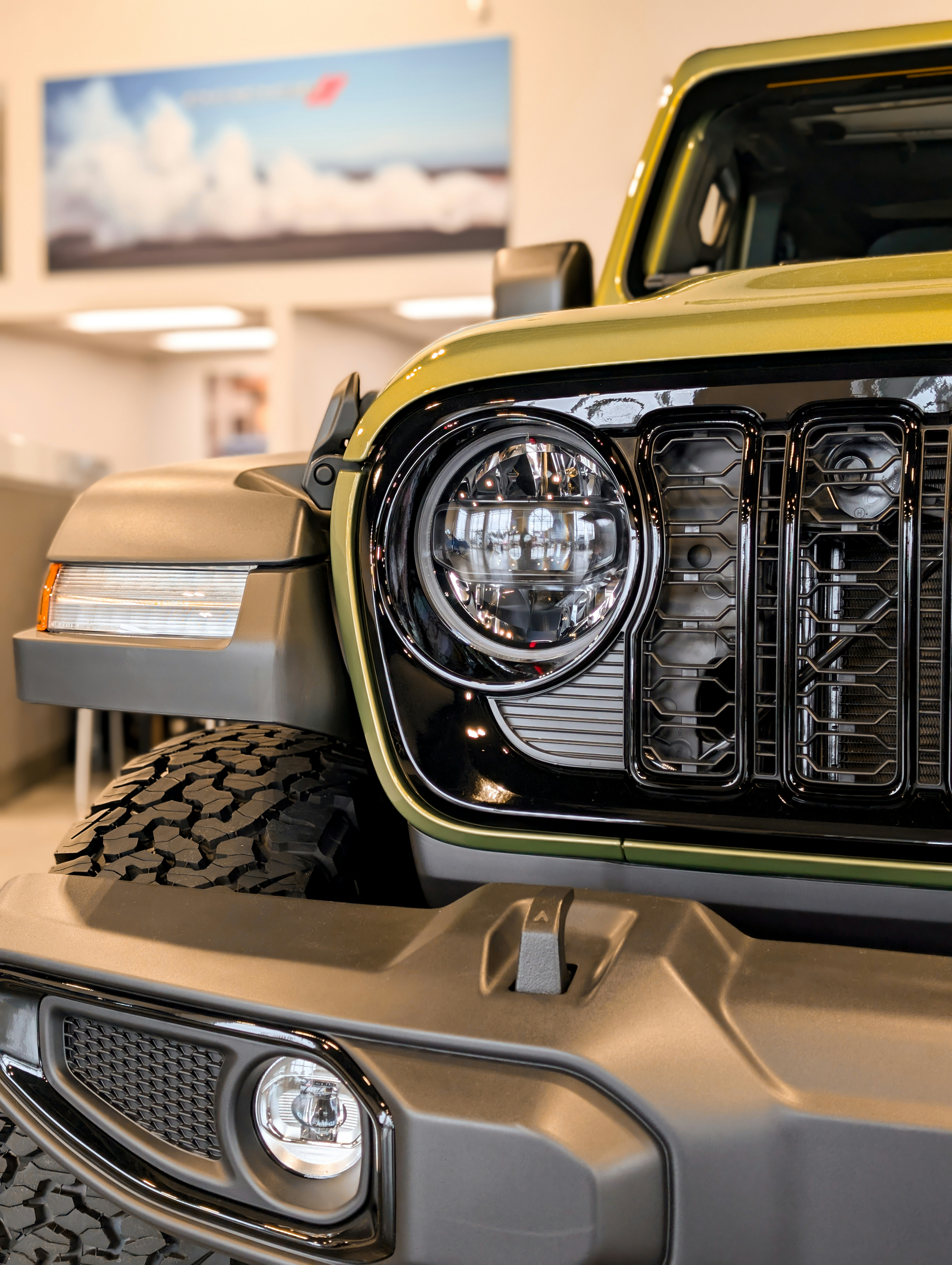 This Jeep looks sensational! The combination of that iconic grille, modern LED headlight, and rugged green finish is just perfect. It's a marvelous blend of classic design and pure capability.