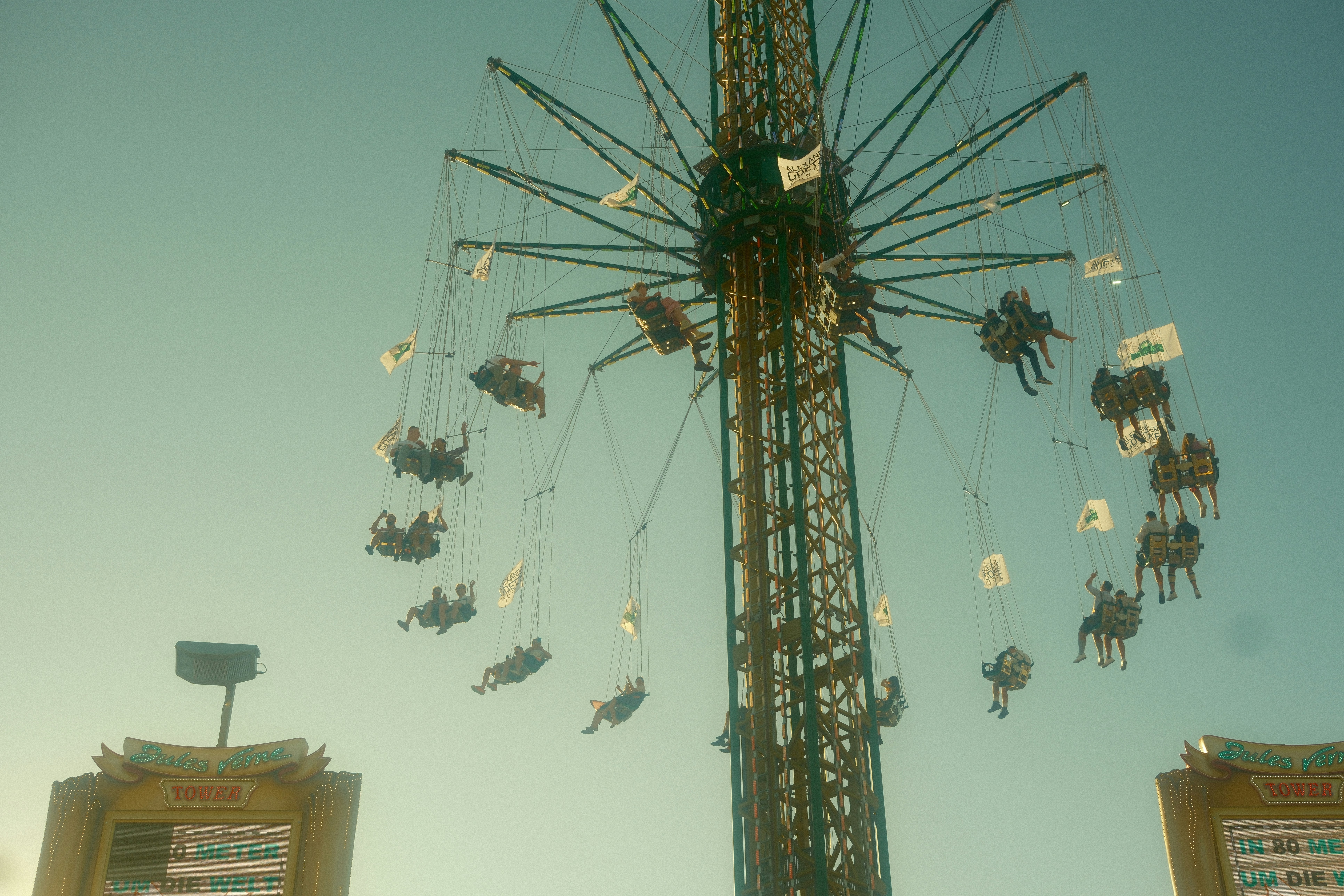 Swing Ride in Subtle Haze at Twilight Amusement Park