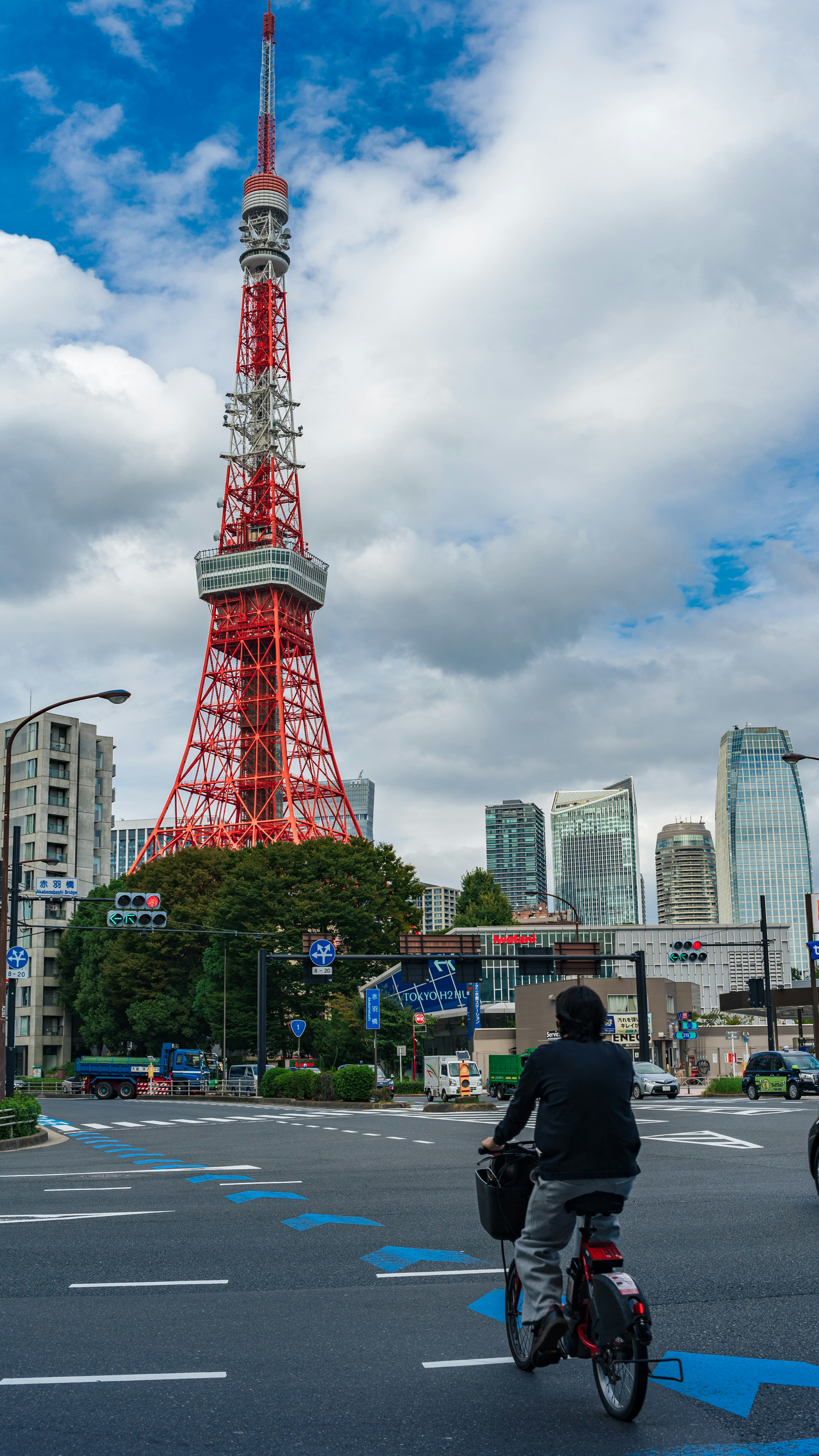 Crimson Lattice Sentinel: Tokyo Tower Looms Over a City Street