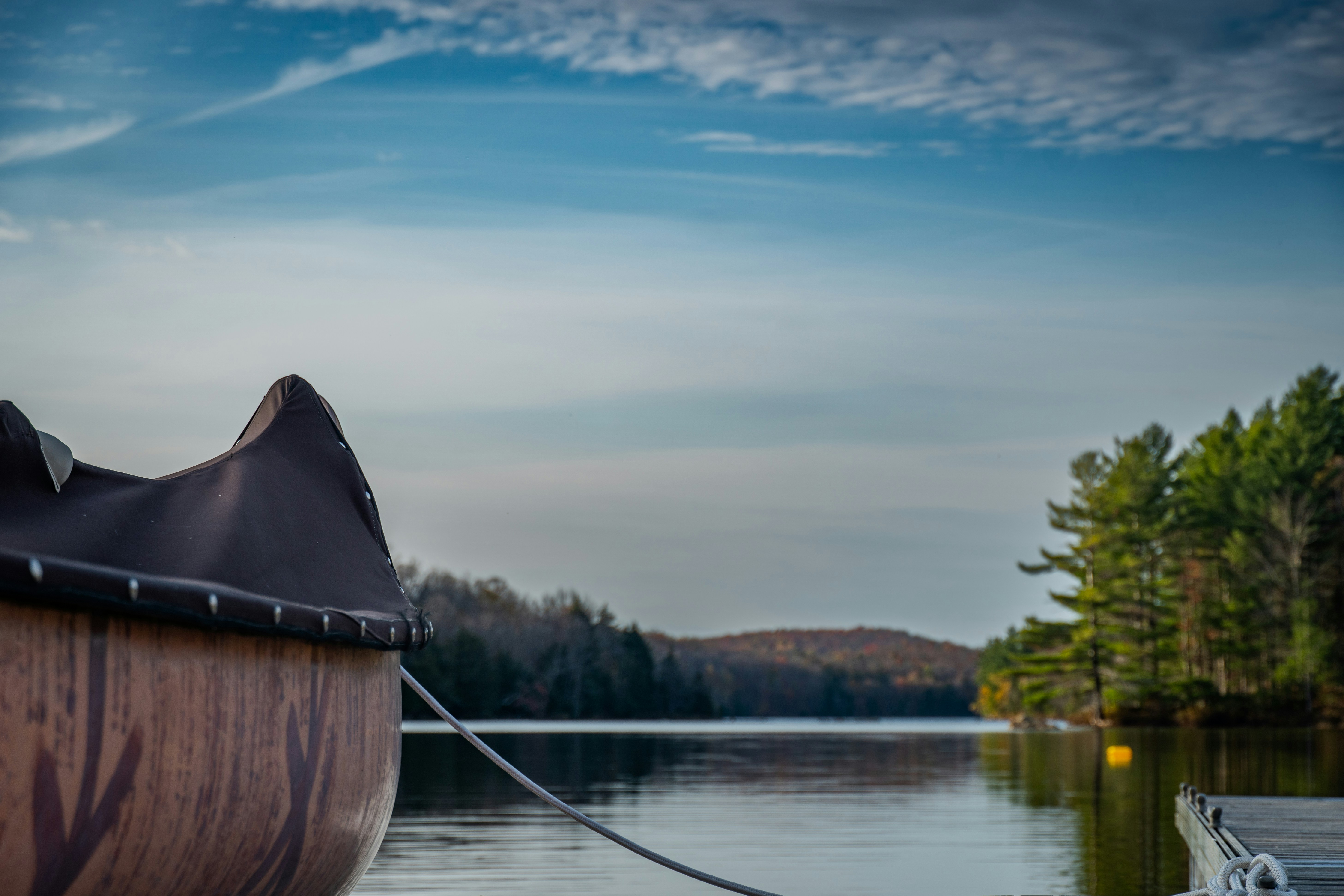 Reflections of Serenity: A Canoe's Embrace