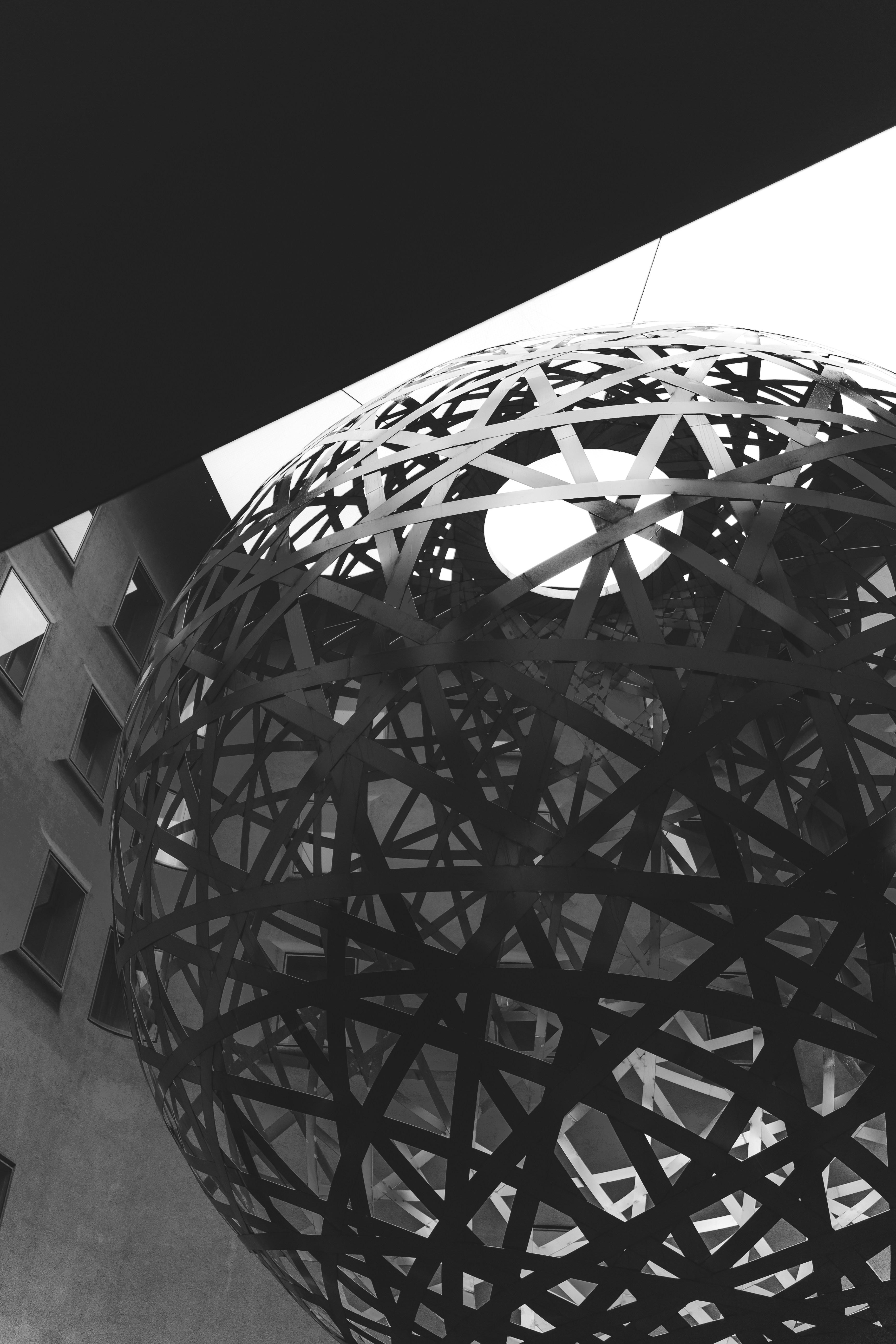 Abstract spherical sculpture with geometric pattern