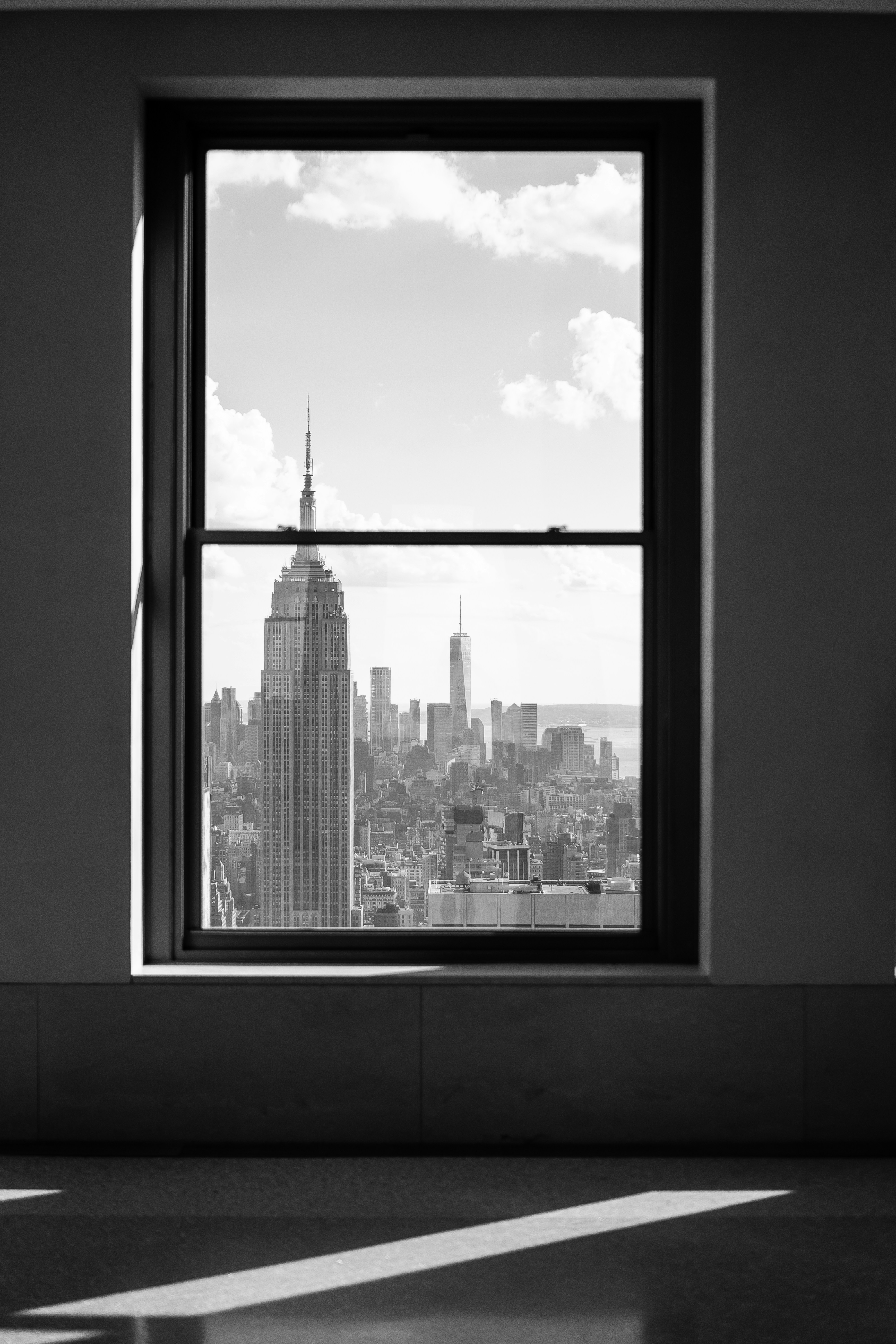 Frame Within a Frame: Empire State in a Quiet Monochrome Cityscape