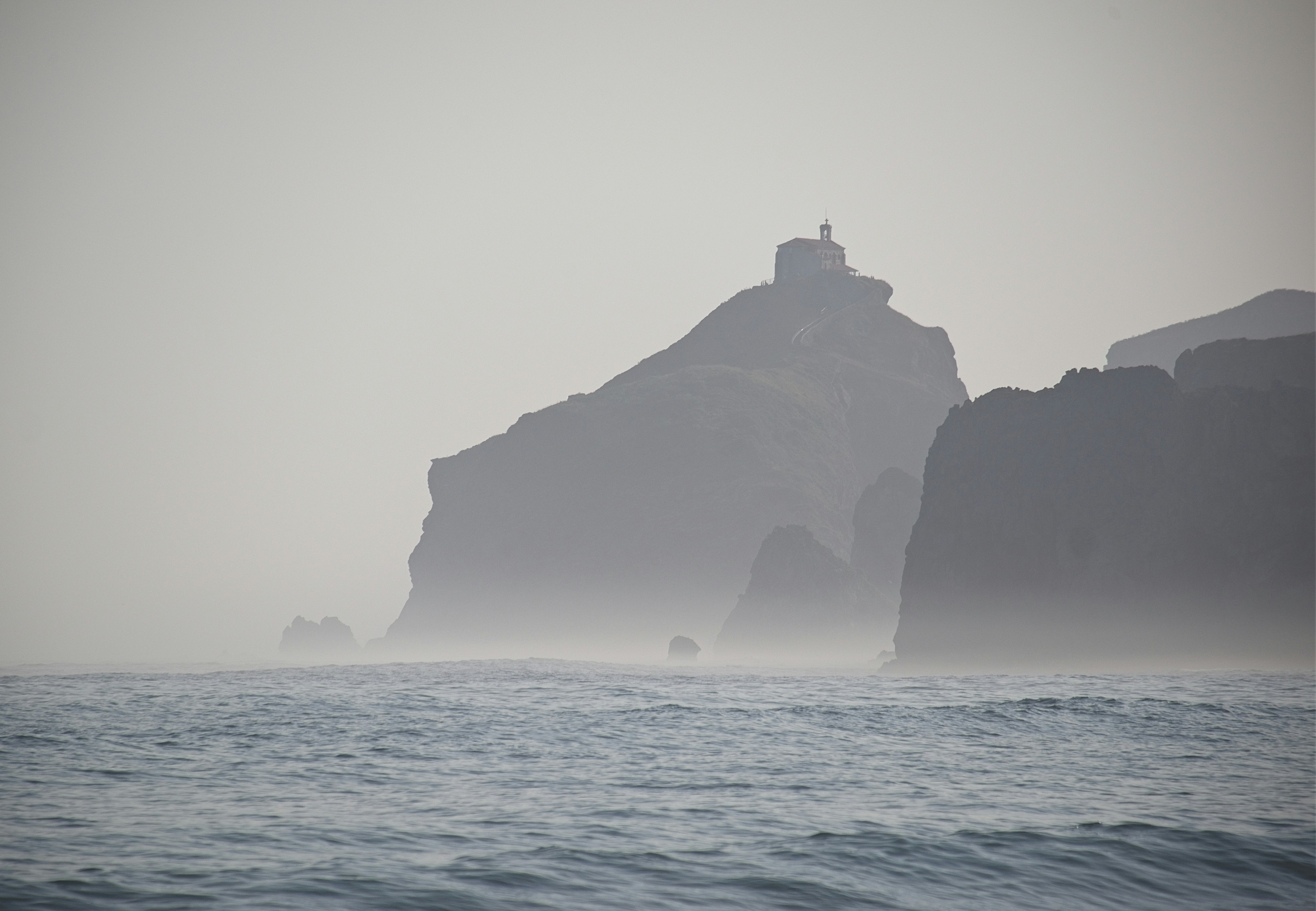 Whispers of the Coastline: A Lighthouse in the Mist
